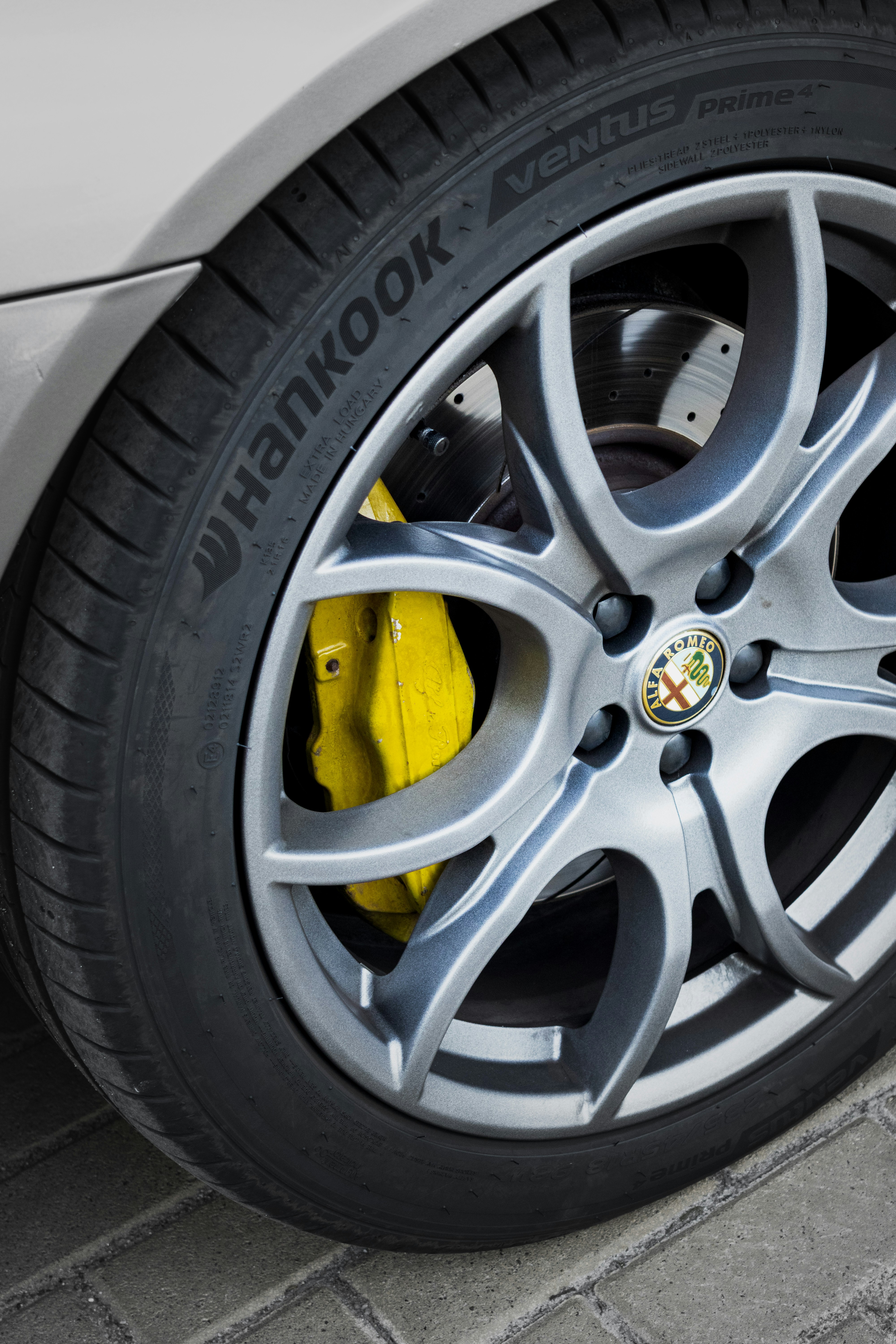 A car wheel with yellow brake calipers. photo – Free Technology Image ...
