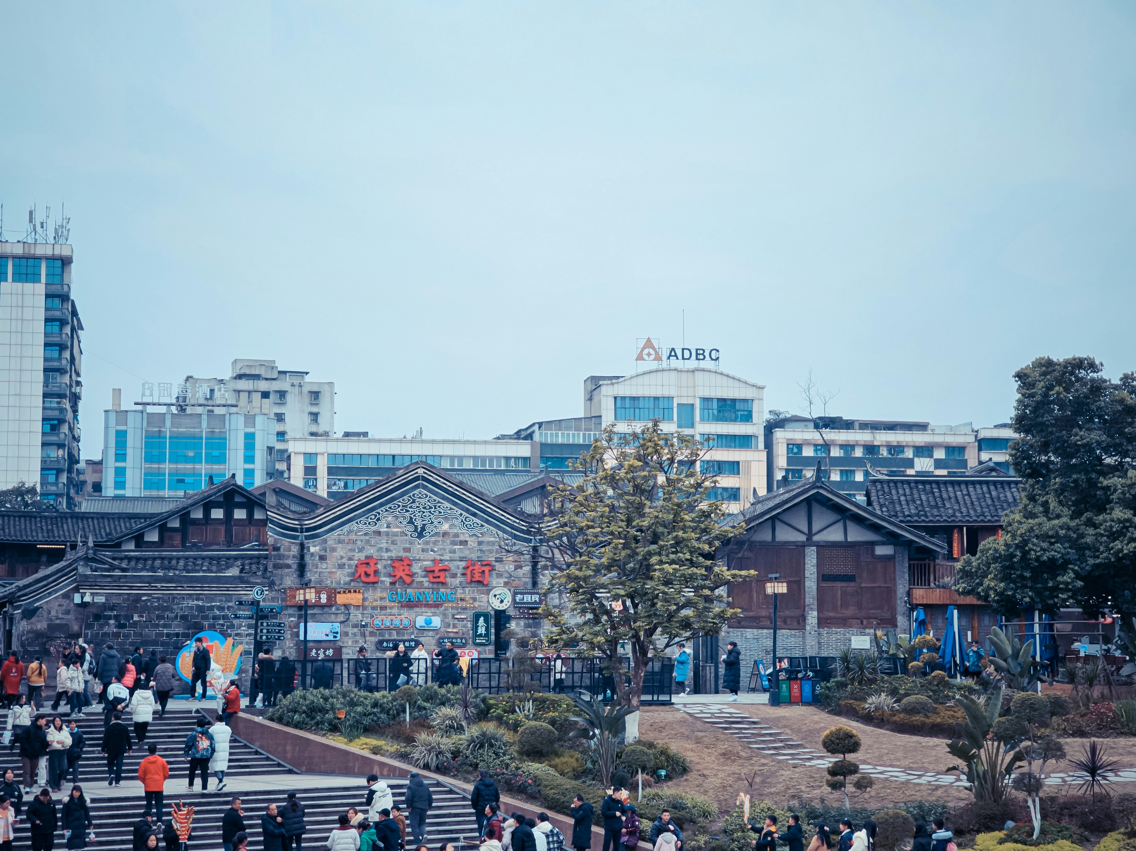 Old Gate, Modern Skyline: Quiet Courtyard Between Eras