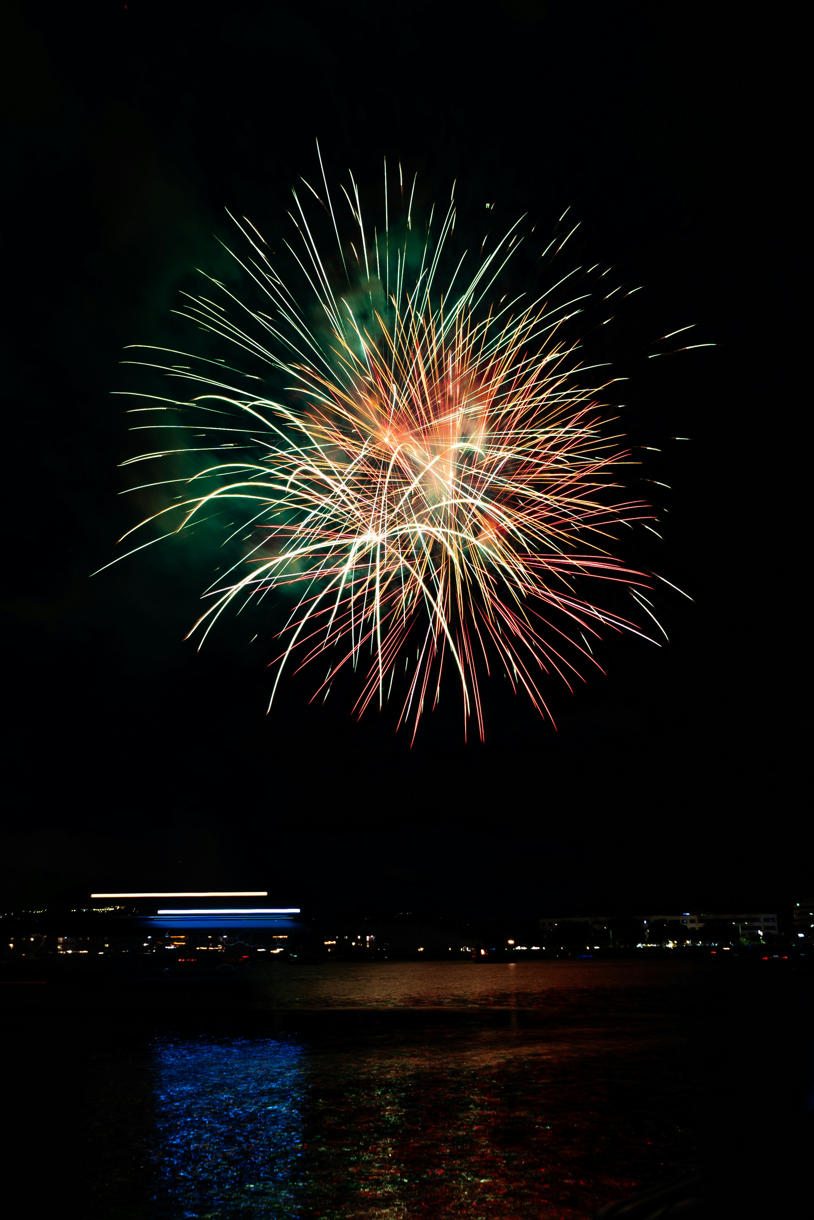 Summer 22, Day 34 - Redeeming the missed fireworks in Foster City During the cross-country road trip, my friends and I had the opportunity to watch the Independence Day fireworks in Foster City. The event was well-attended, with a massive crowd, and everyone was prepared with their gear to enjoy the show. The fireworks lit up the night sky with their vibrant hues, creating a breathtaking display of color and light. The highlight of the evening was the reflection of the colorful fireworks on the San Francisco Bay Area, enhancing the already stunning experience.
