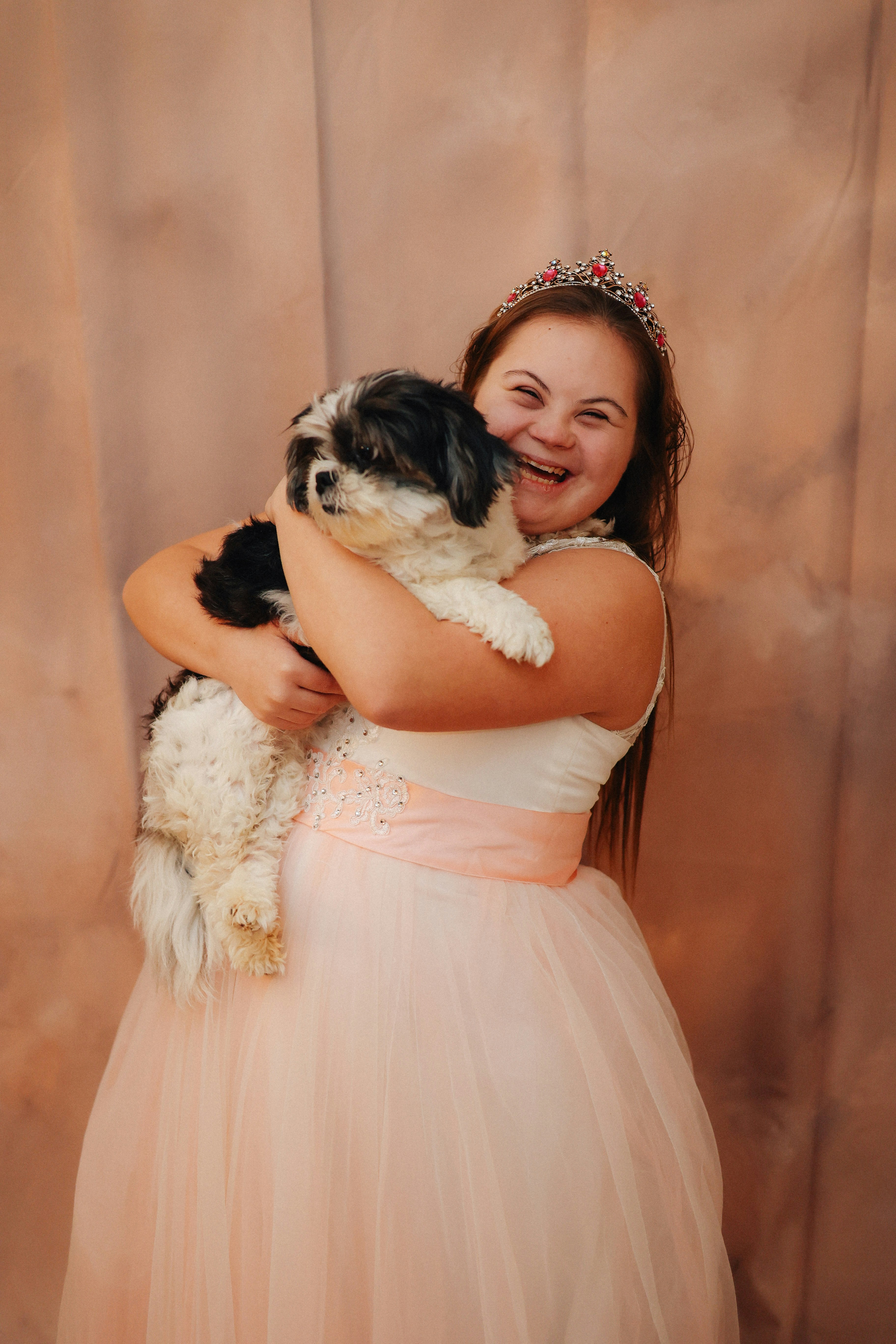 Princess in Pink: A Warm Embrace with a Fluffy Companion
