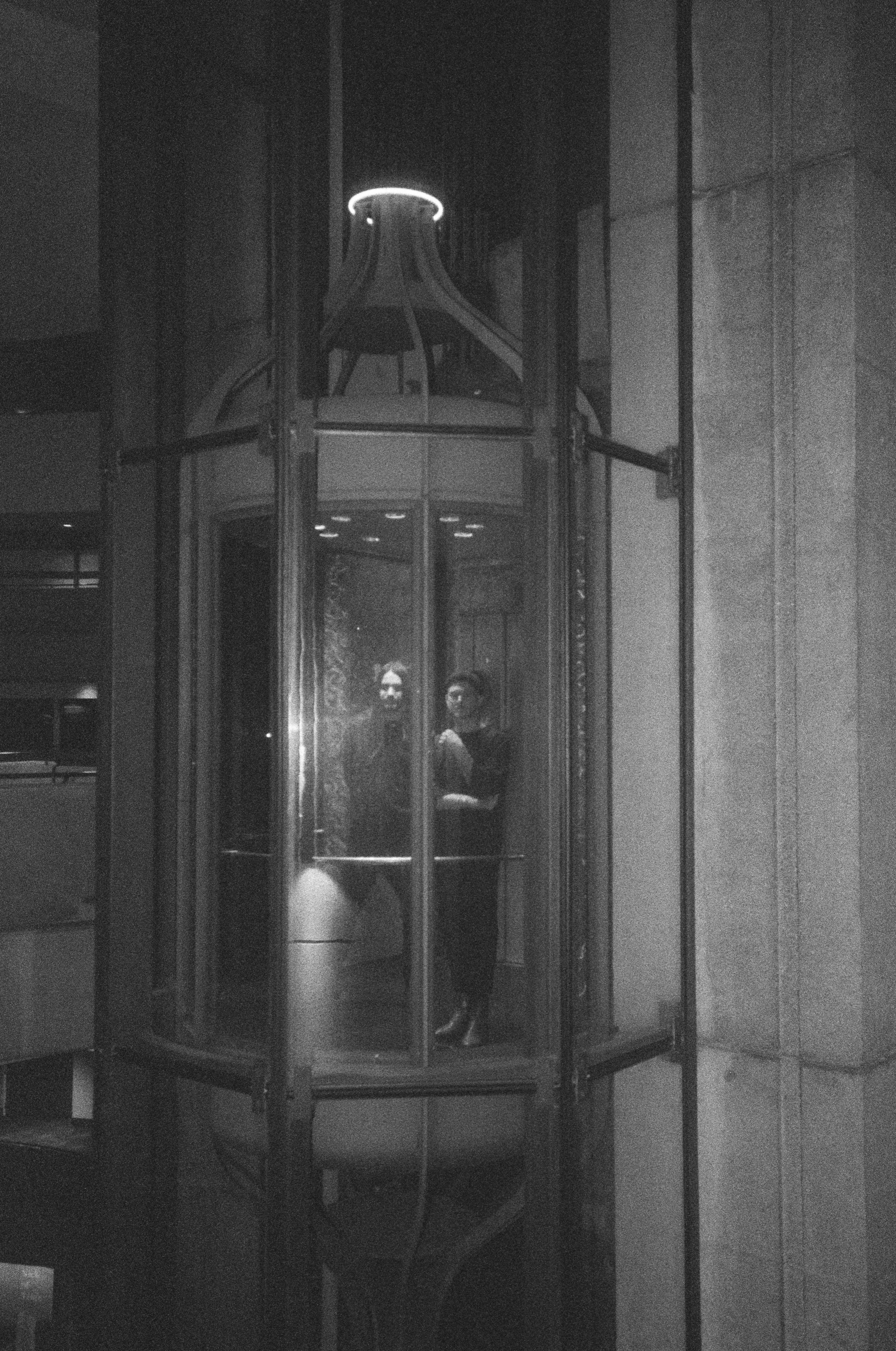A couple rides in an elevator. photo – Free Night Image on Unsplash