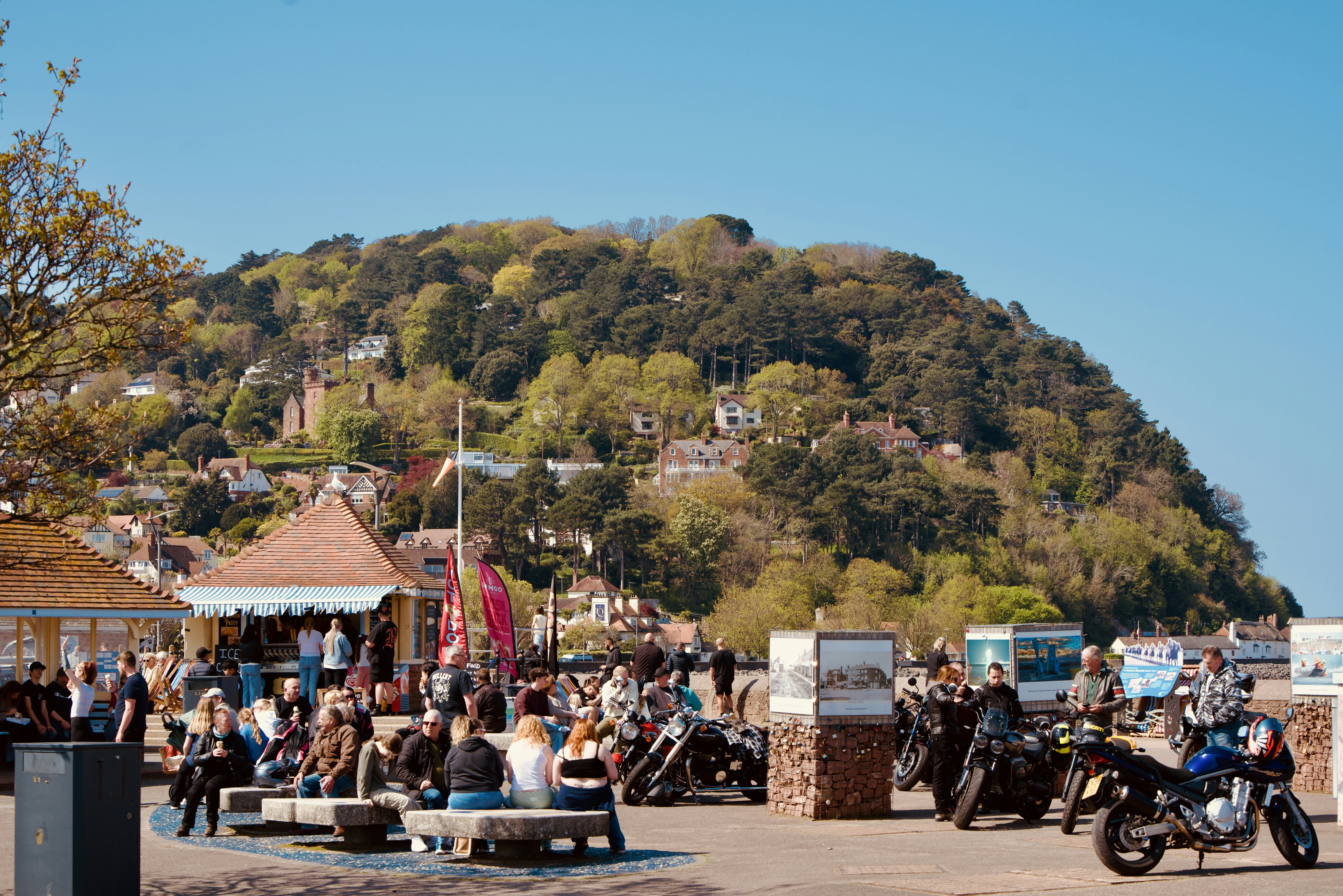 Seaside Plaza: People, Motorcycles and a Hilltop Village