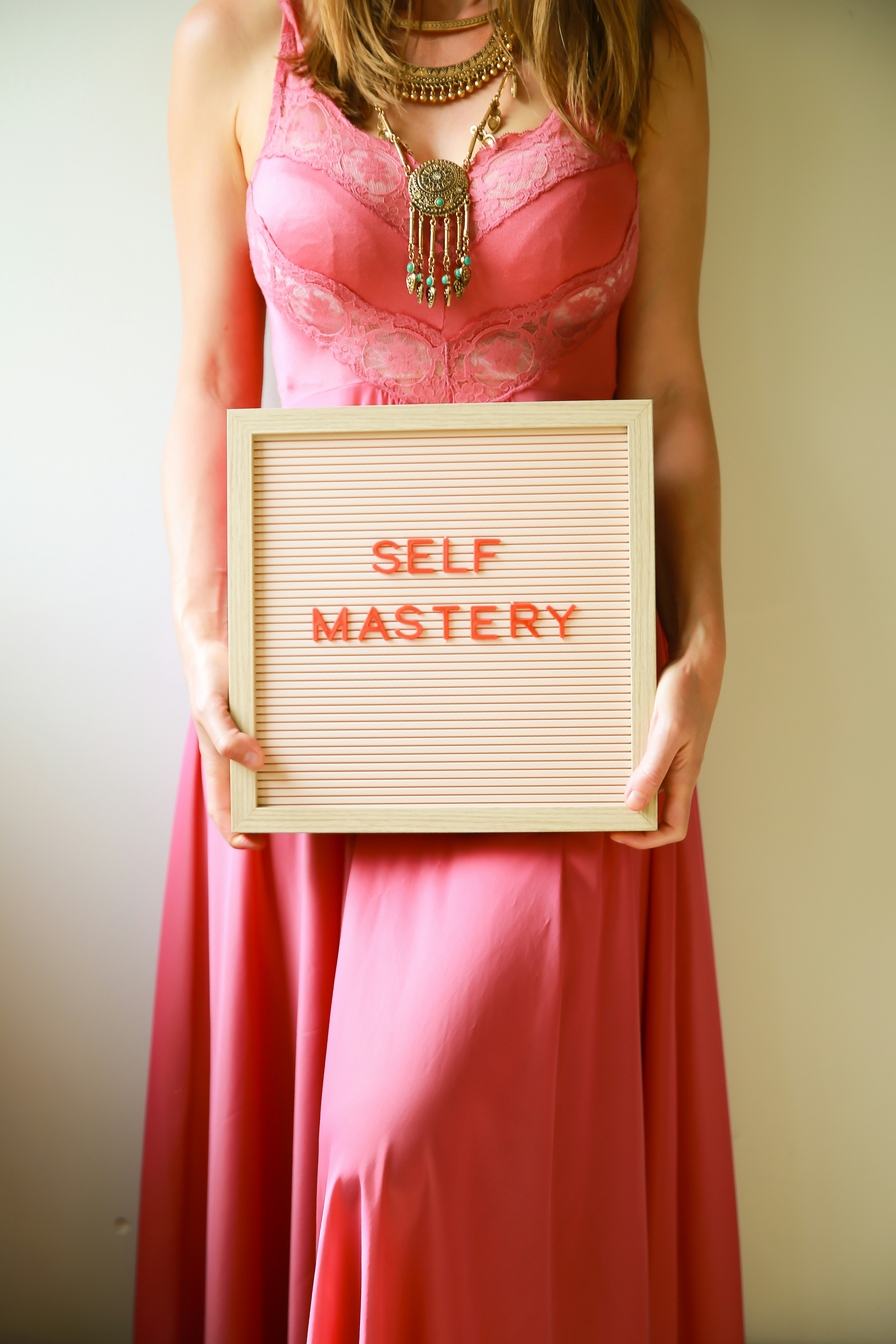Woman holds a sign that says "self mastery." photo – Free Woman Image ...