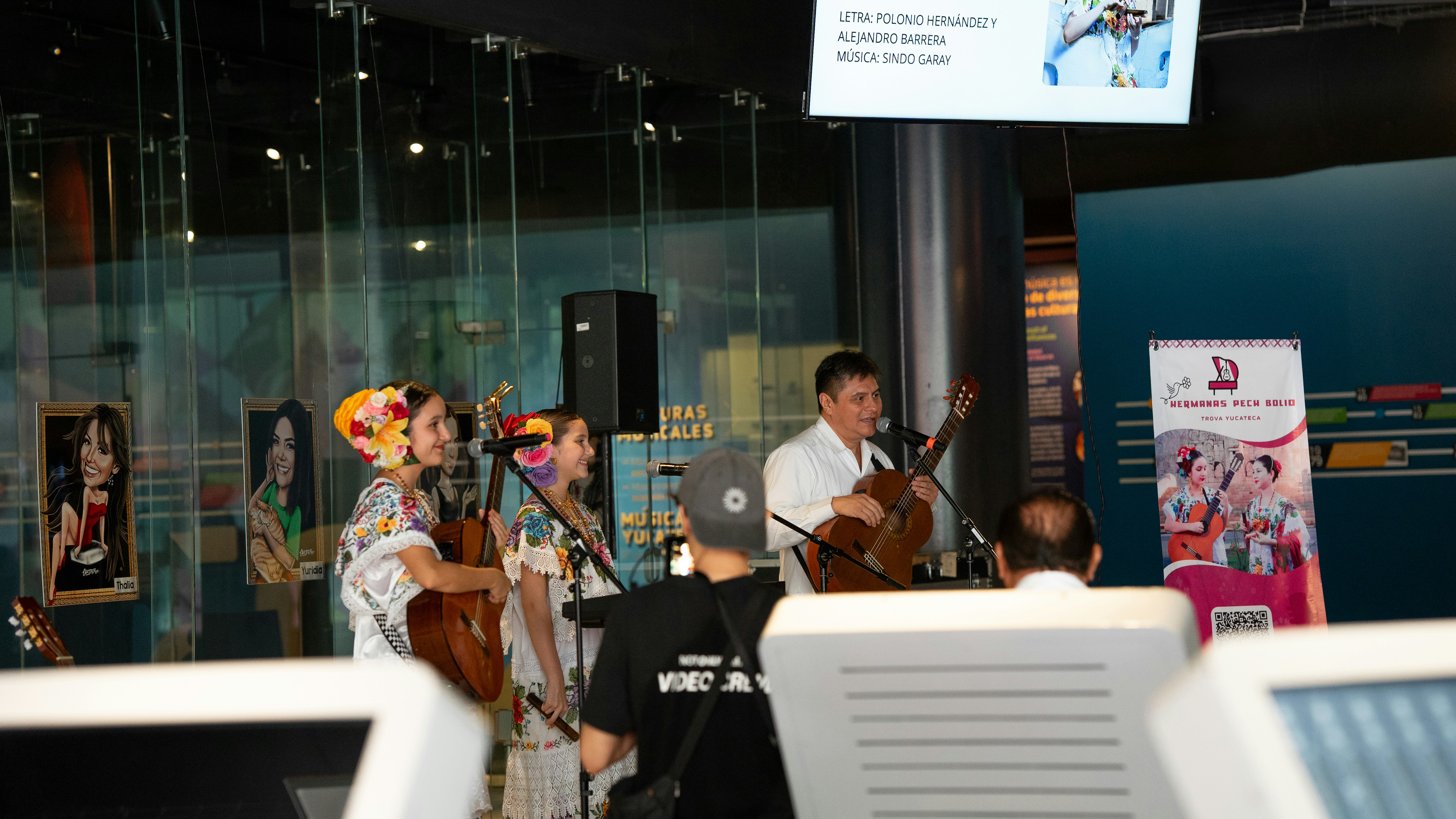 Harmonic Street Performance: Trio of Musicians and a Guitarist