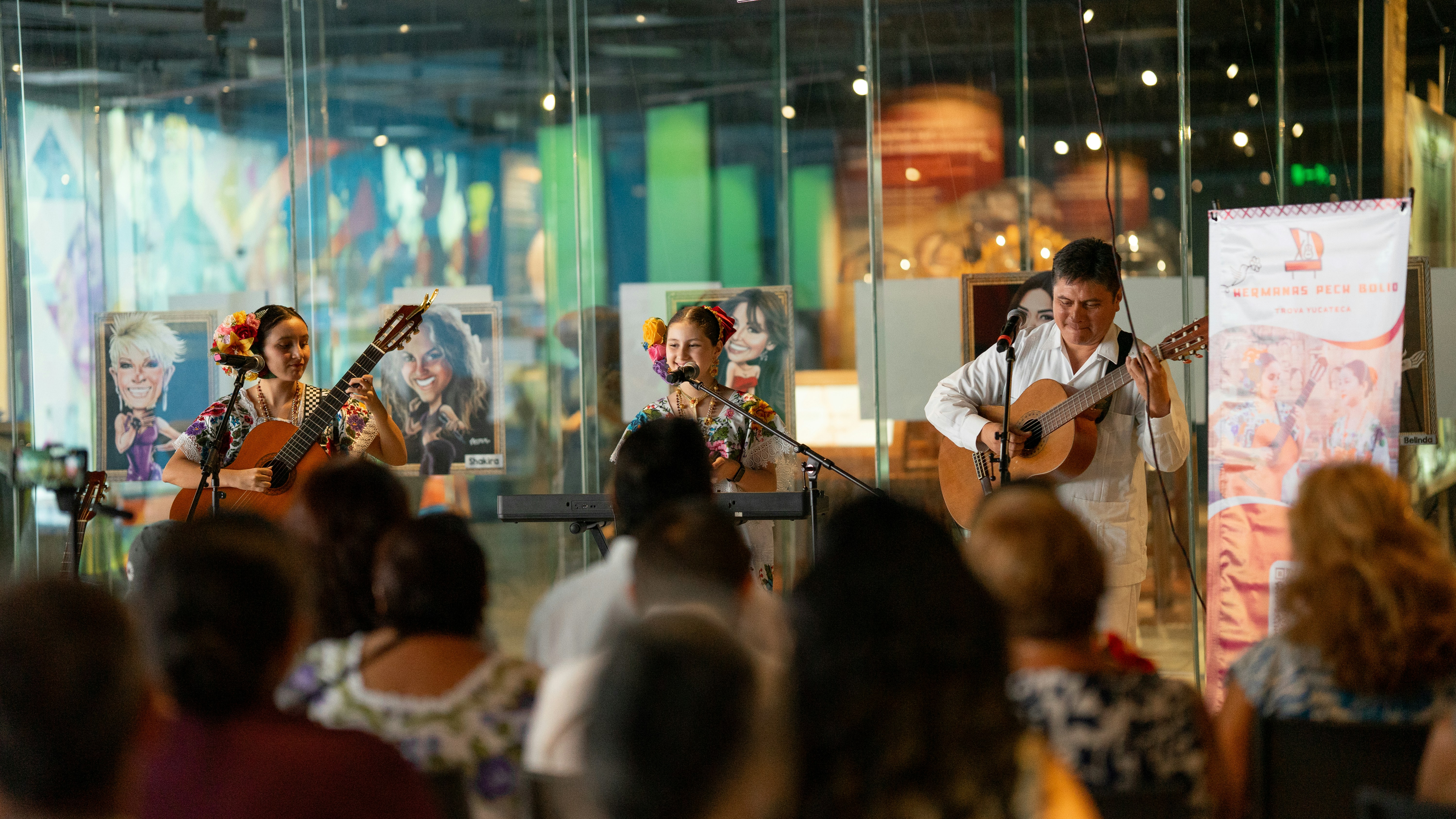 Midnight Serenade: a quartet of guitarists serenade a dimly lit gallery stage