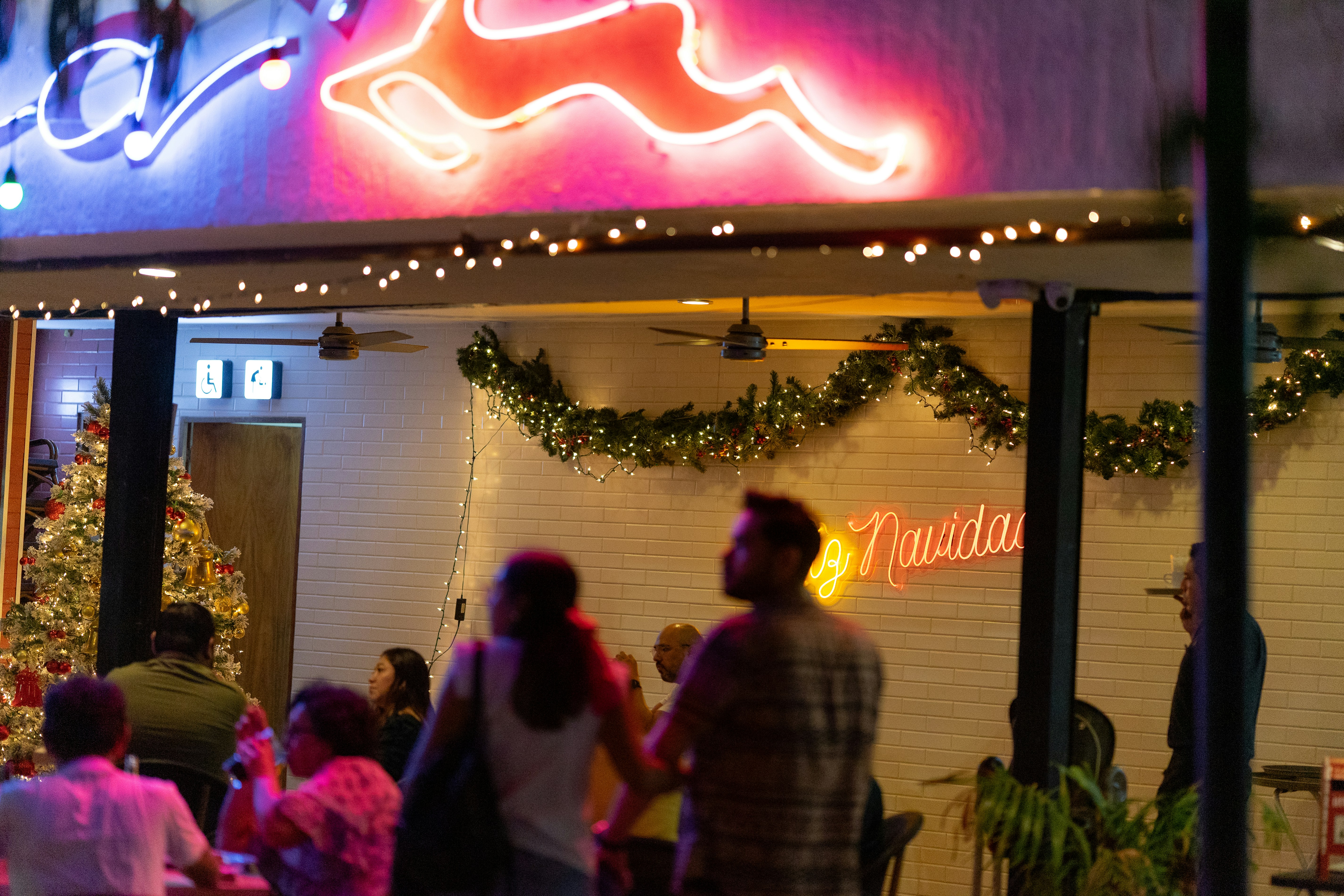 Holiday Nightlife Beneath Neon Glow