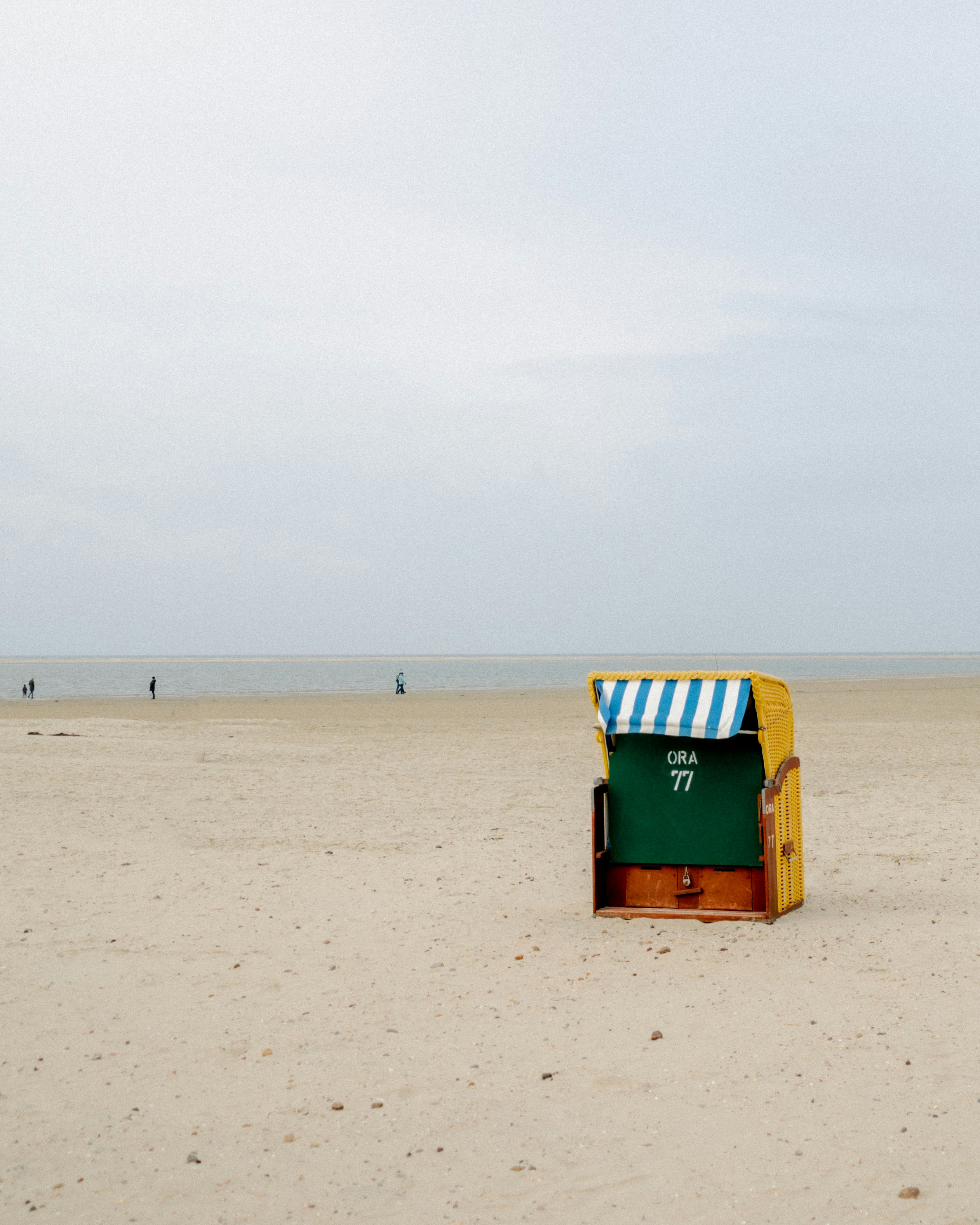 Solitary Beach Chair on a Quiet Horizon