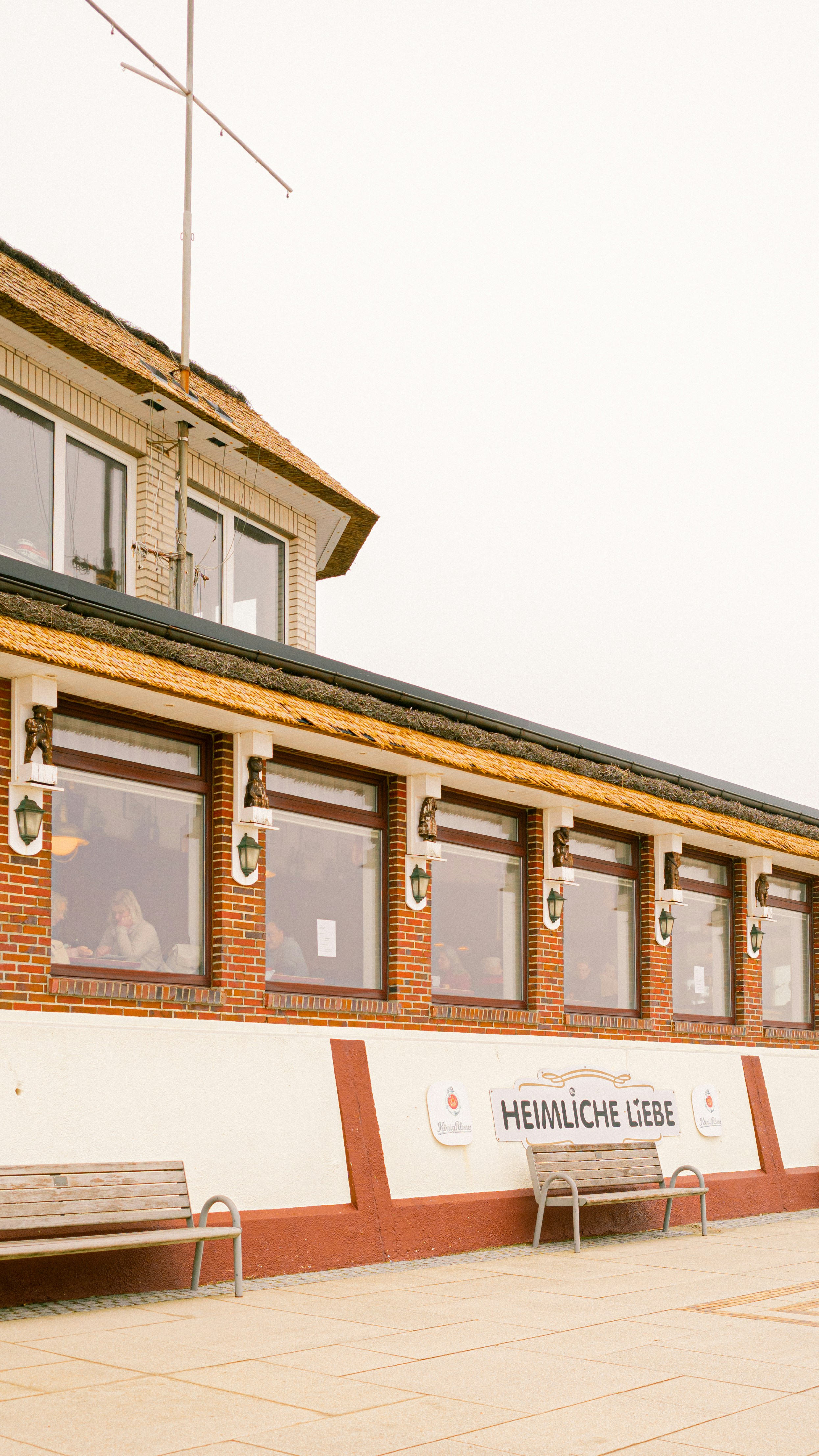 Secret-Love Sign Above a Row of Brick Windows
