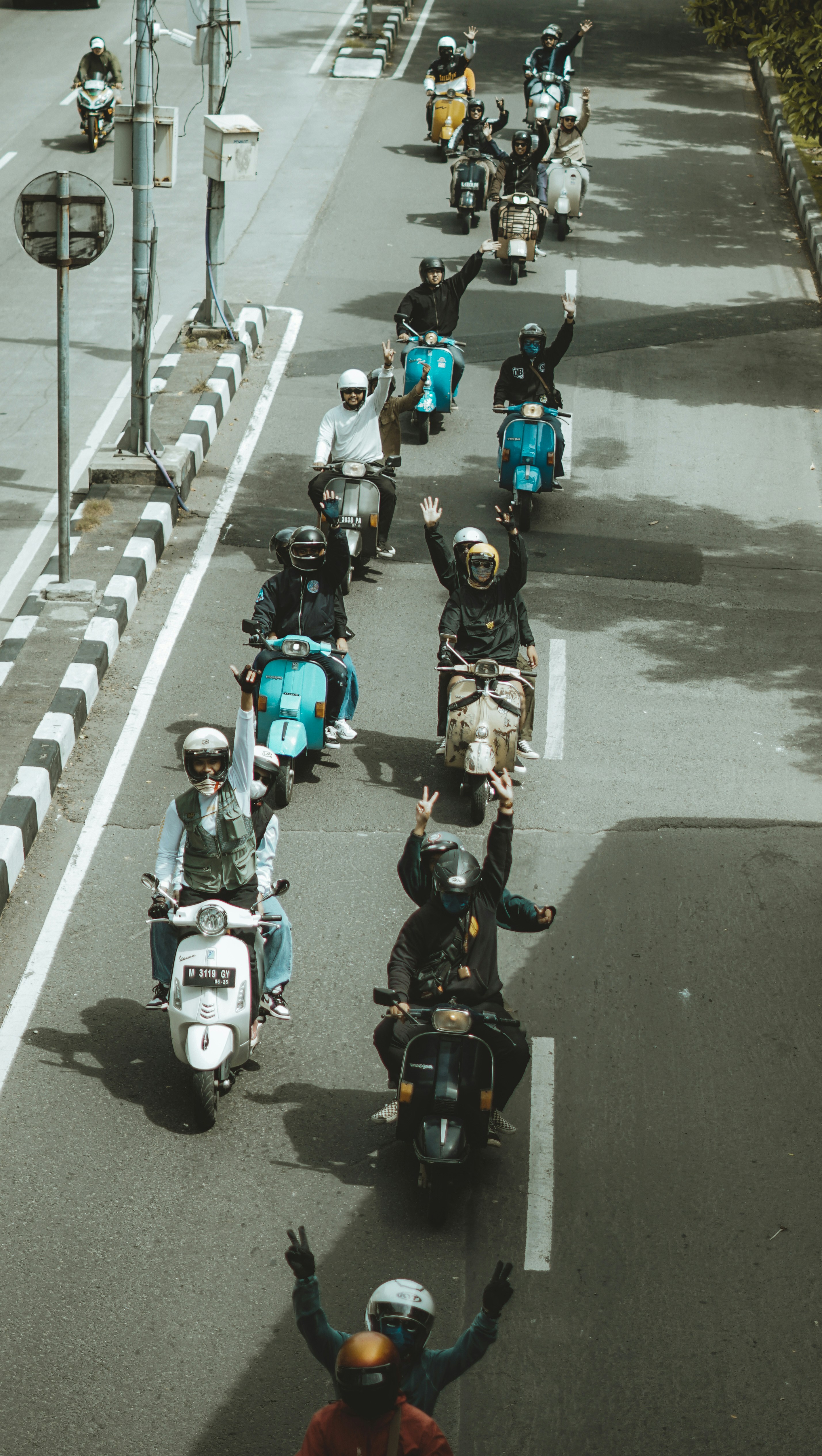 A group of people on scooters are riding together. photo – Free Love ...