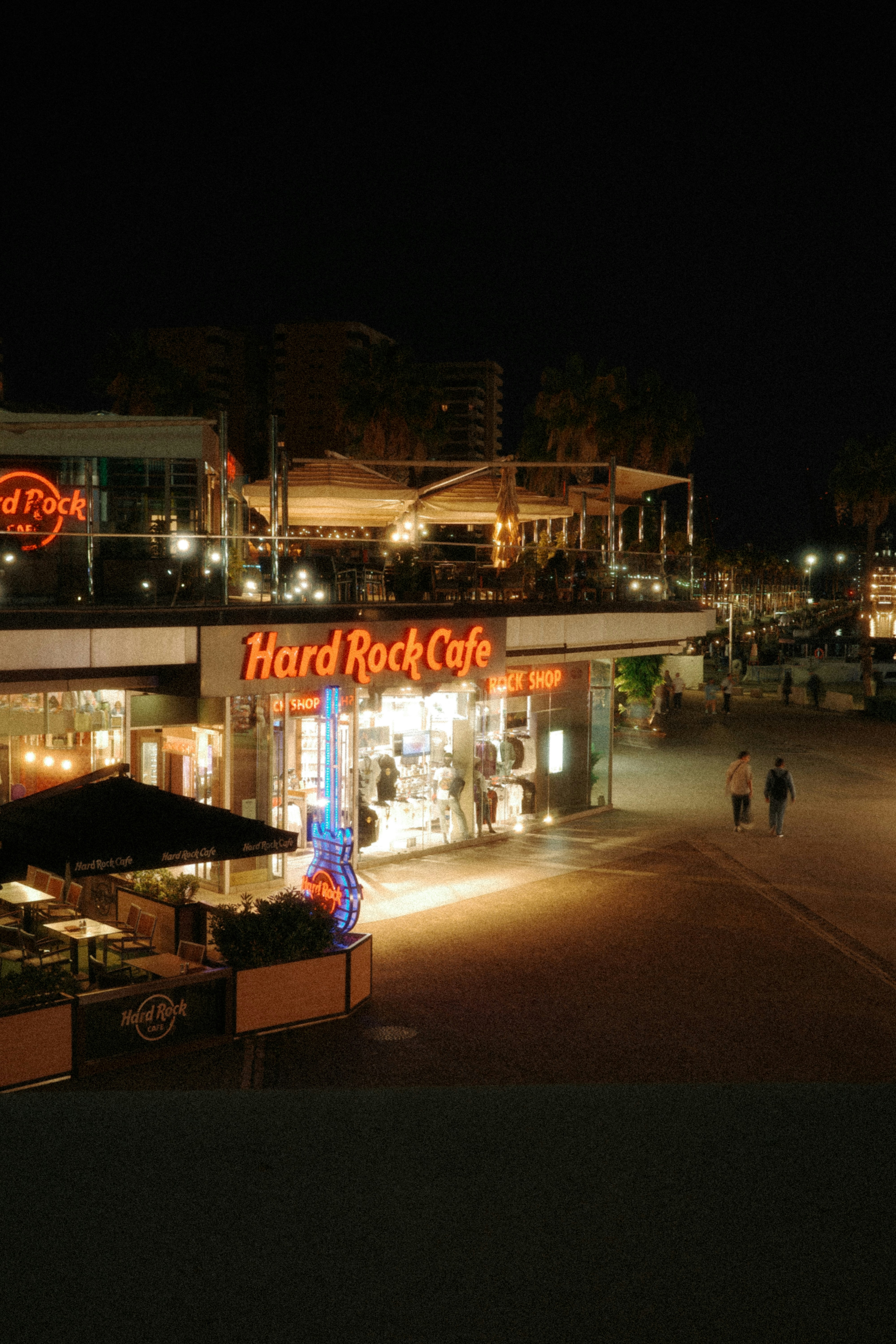 Neon Glow Over the Hard Rock Café Promenade at Night