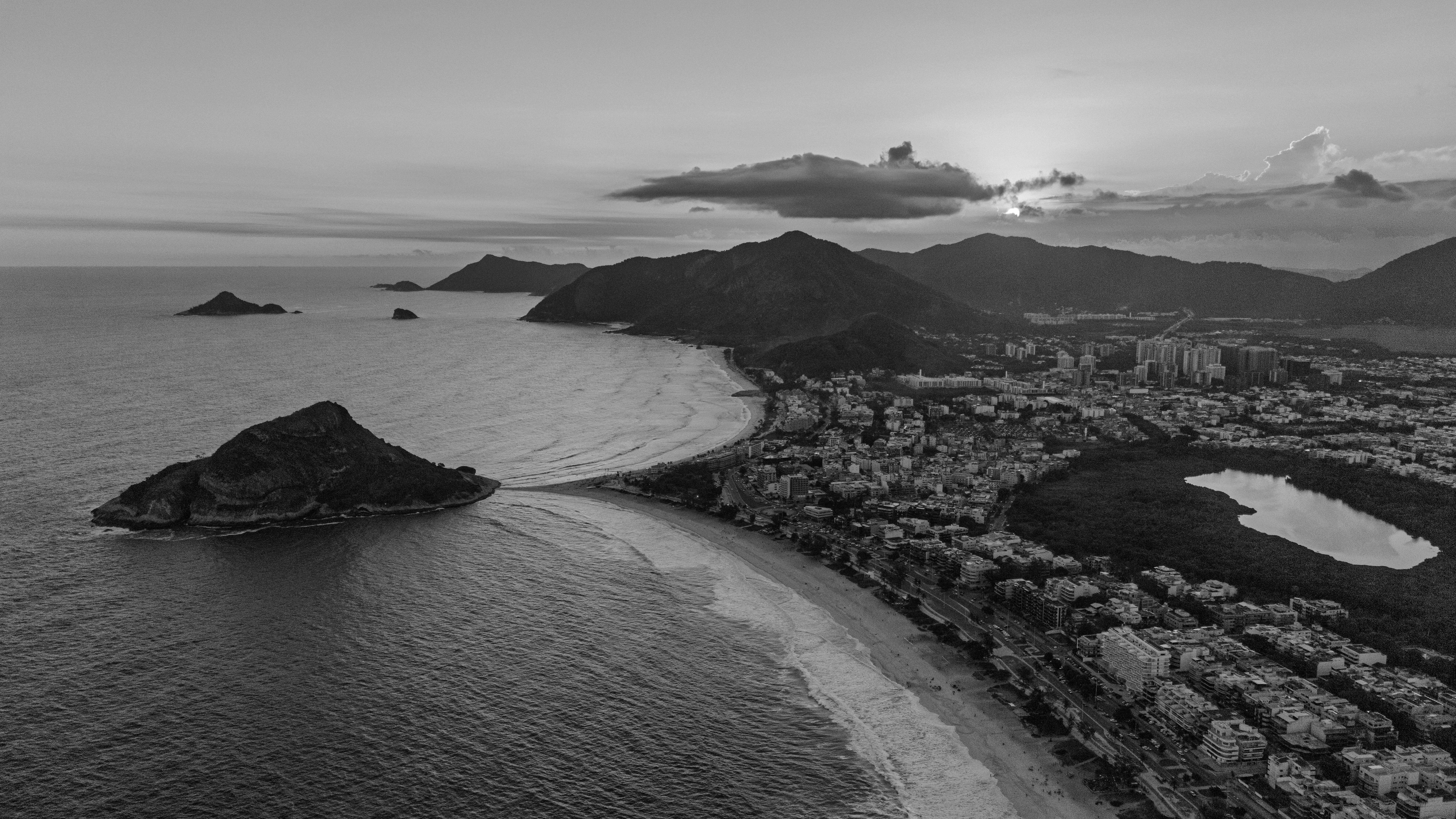 Moonlit Coastline: Aerial Study of Island, Ridge, and City