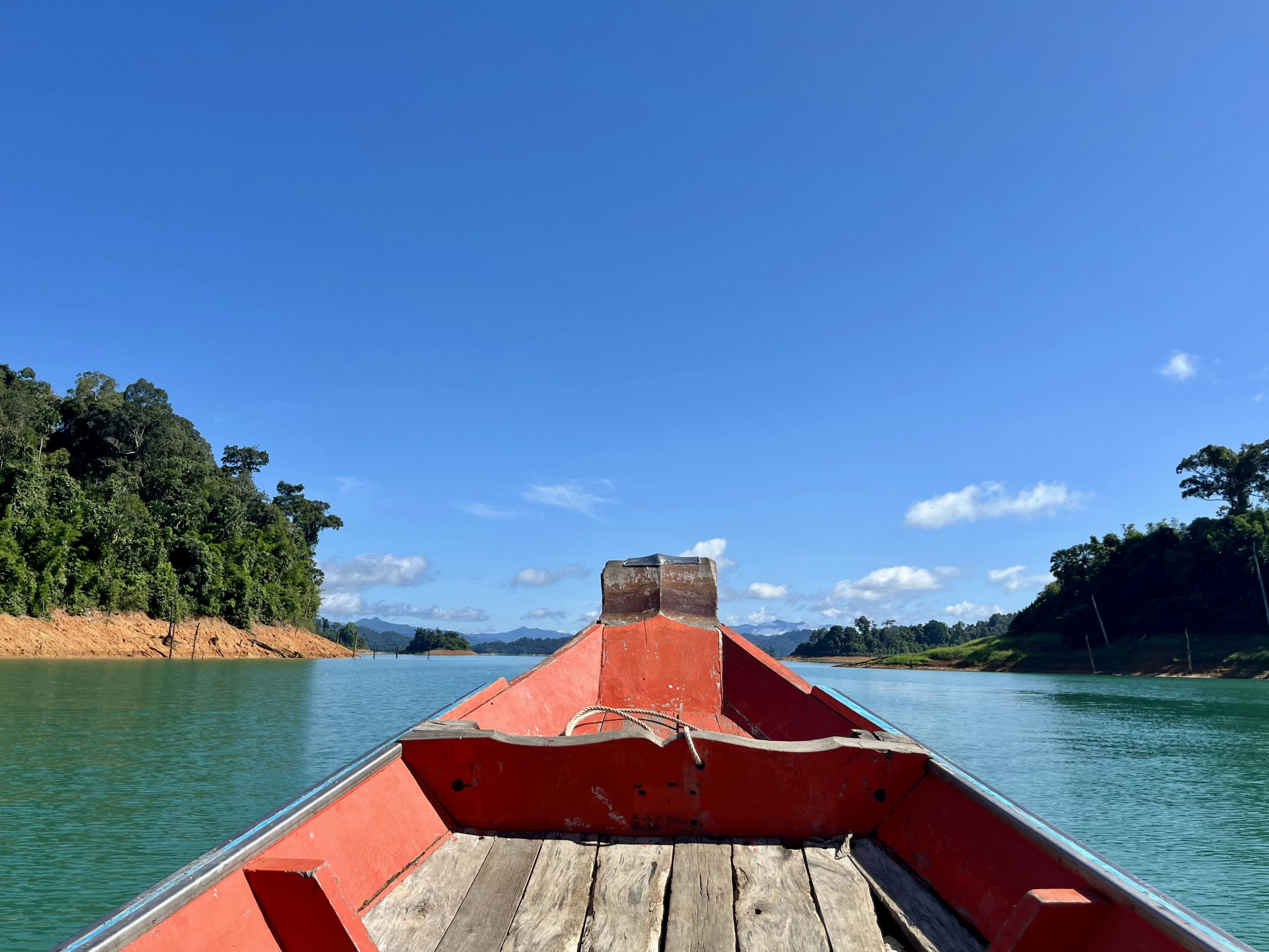 Red Bow, Quiet Water: A Front-Seat View Down a Serene River