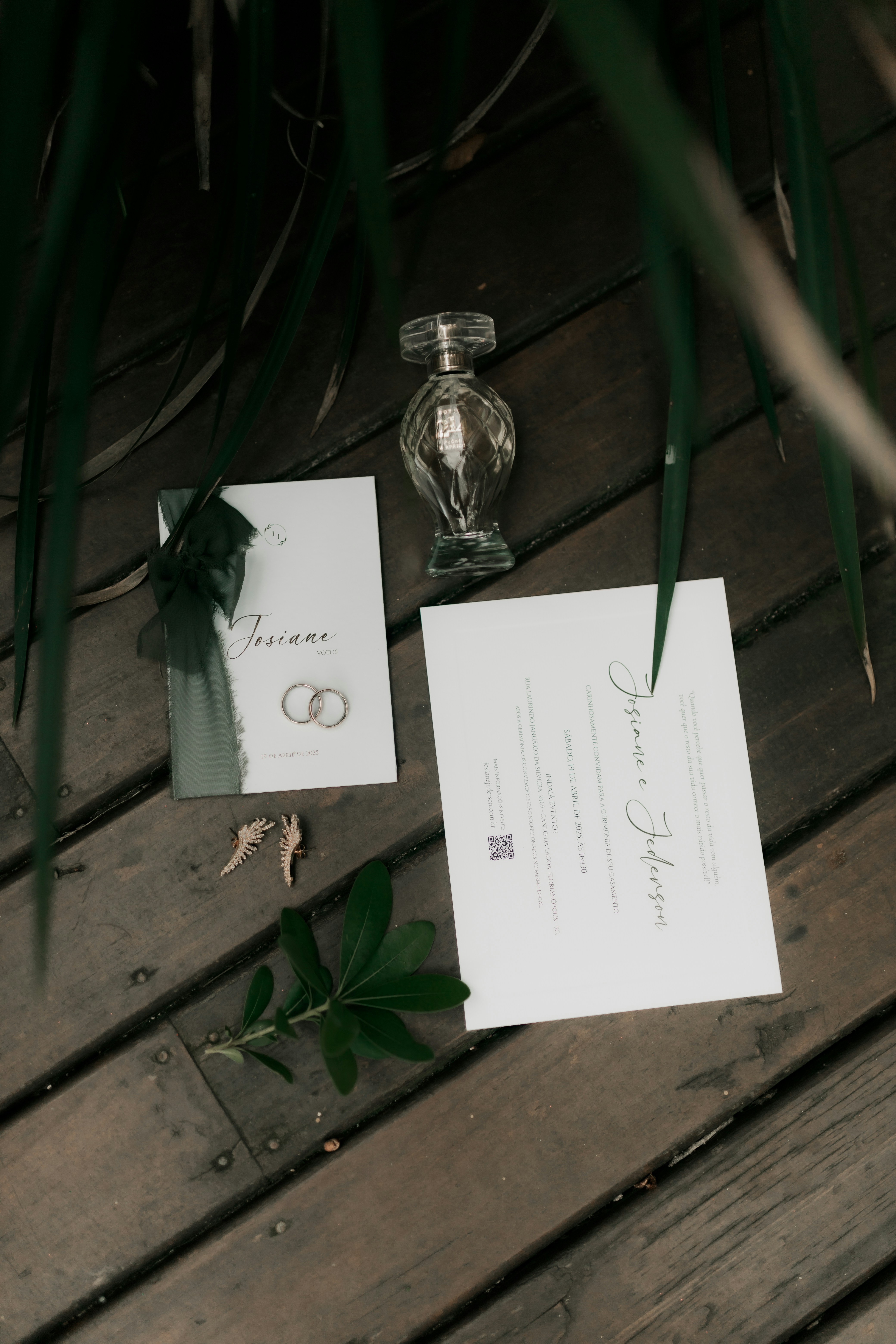 Wedding invitation details and a decorative perfume bottle. photo ...