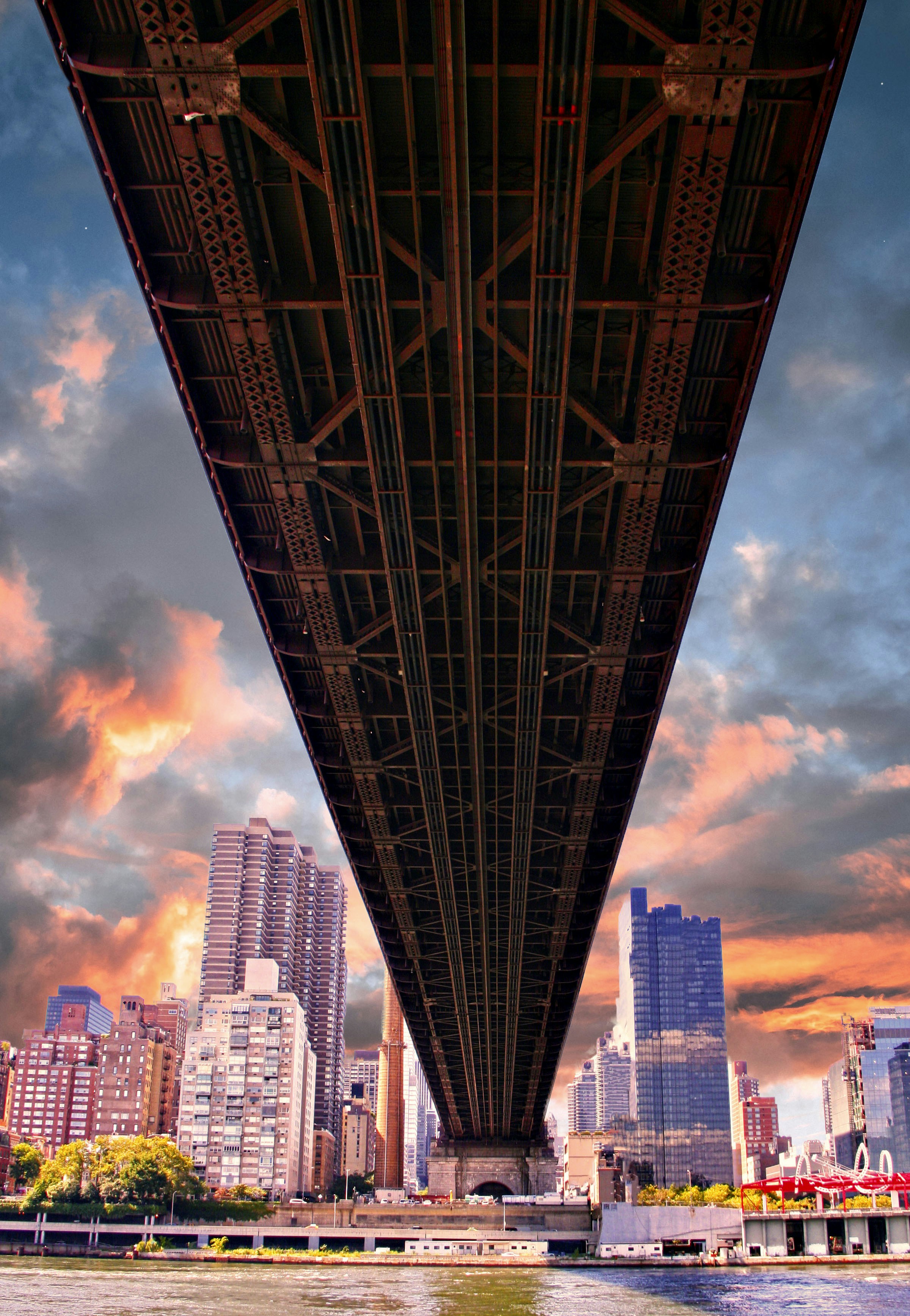 Underbridge Horizon: Sunset Framed by Steel and Skyline