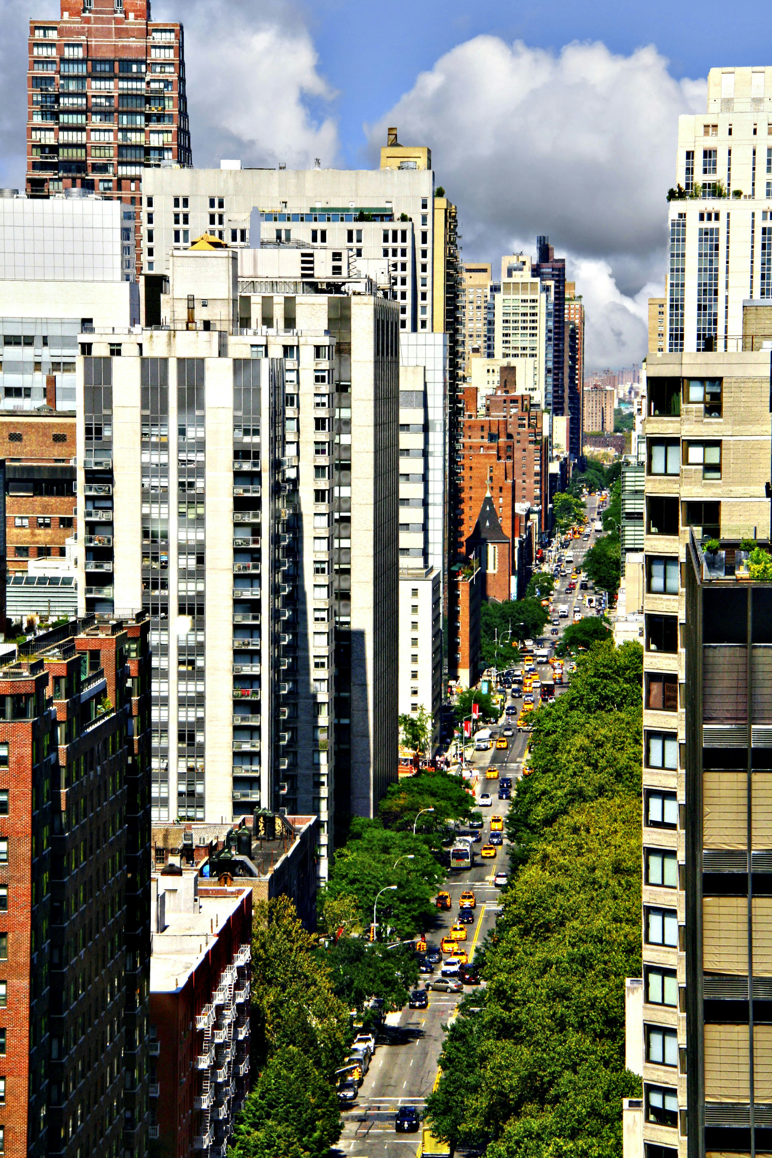 Skyward Street: A Sunlit Urban Canyon Between Skyscrapers