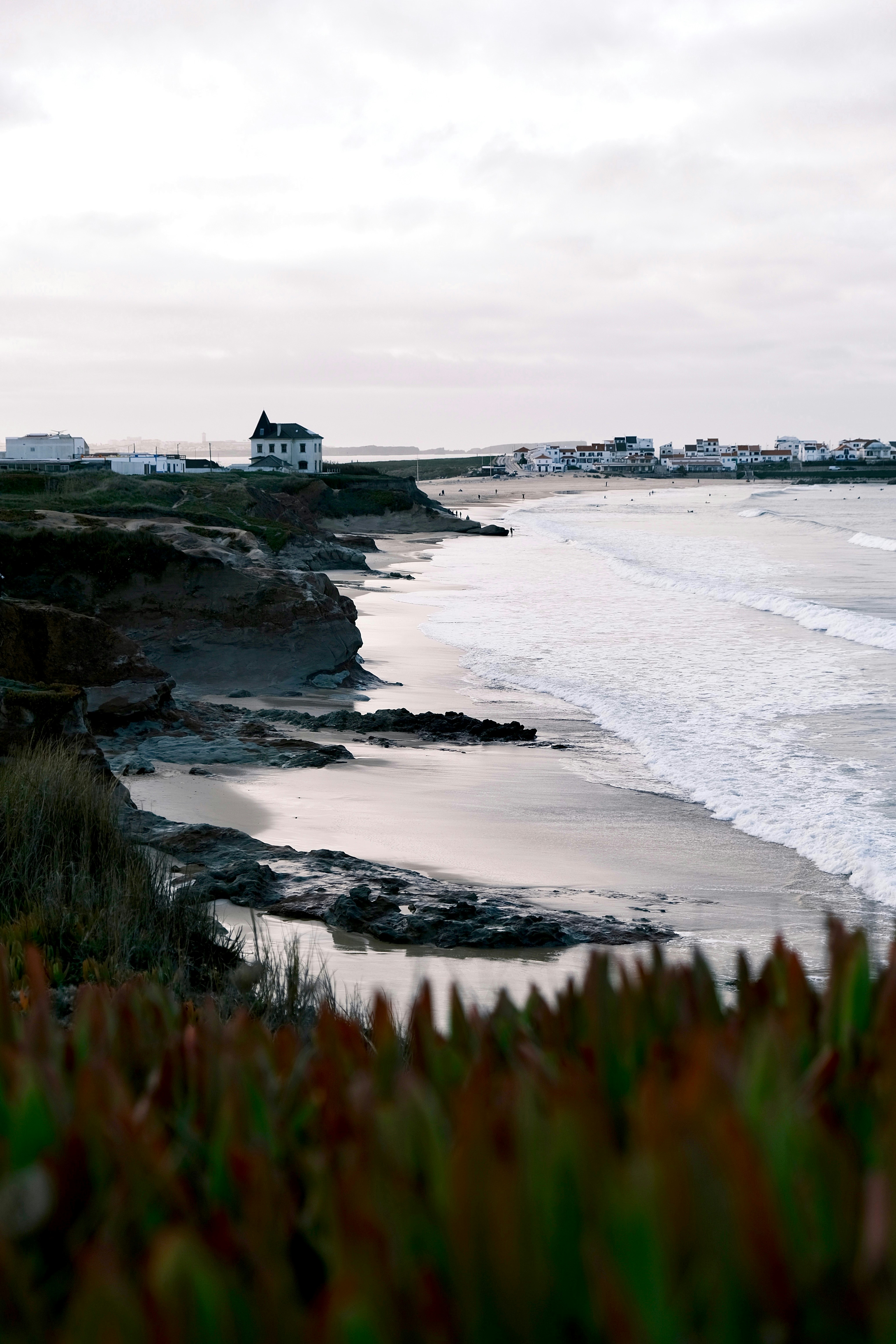 Coastal Cliffs and Quiet Town: A Distant Shoreline Morning