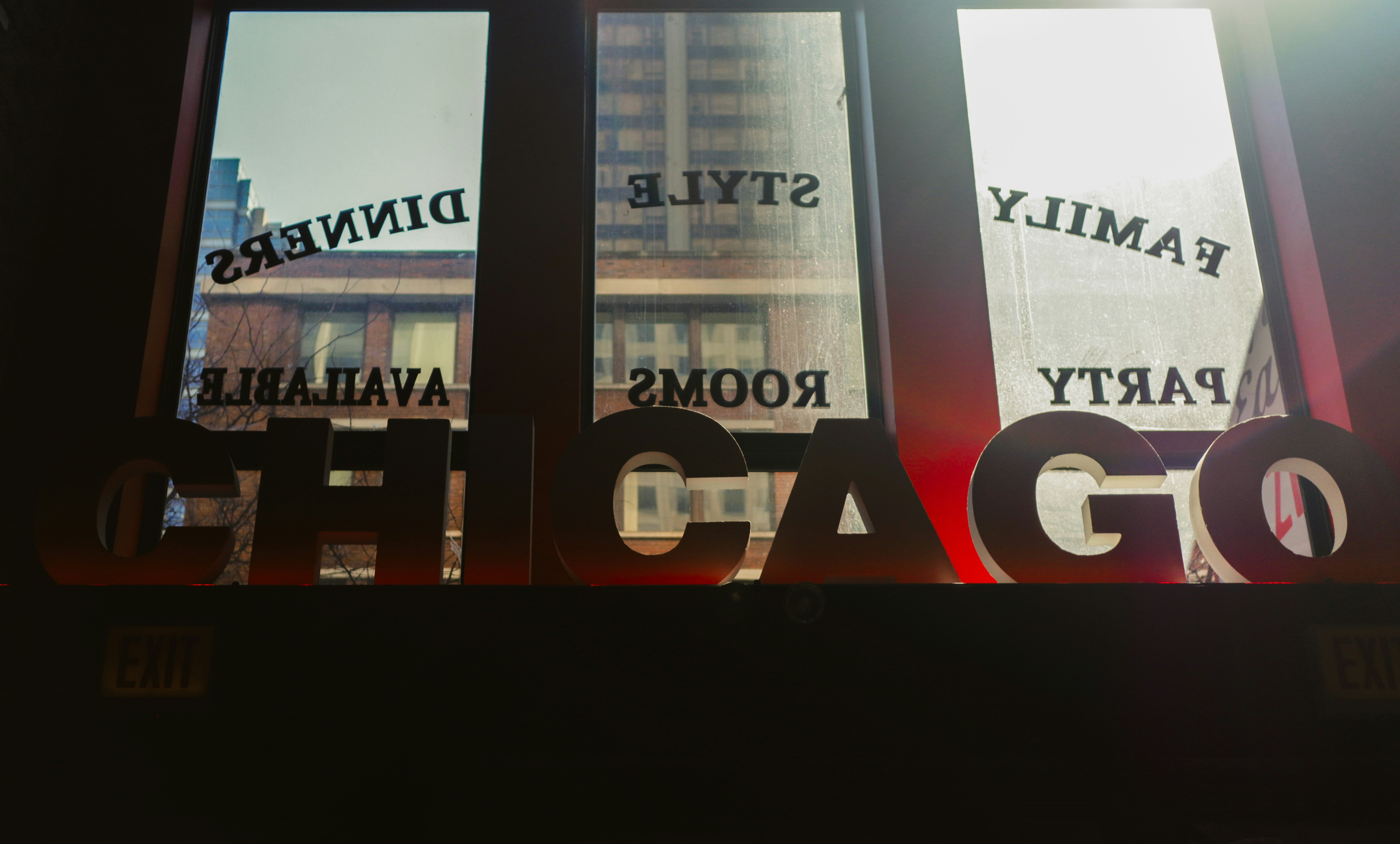 Chicago sign with restaurant offerings on windows. photo – Free Chicago ...