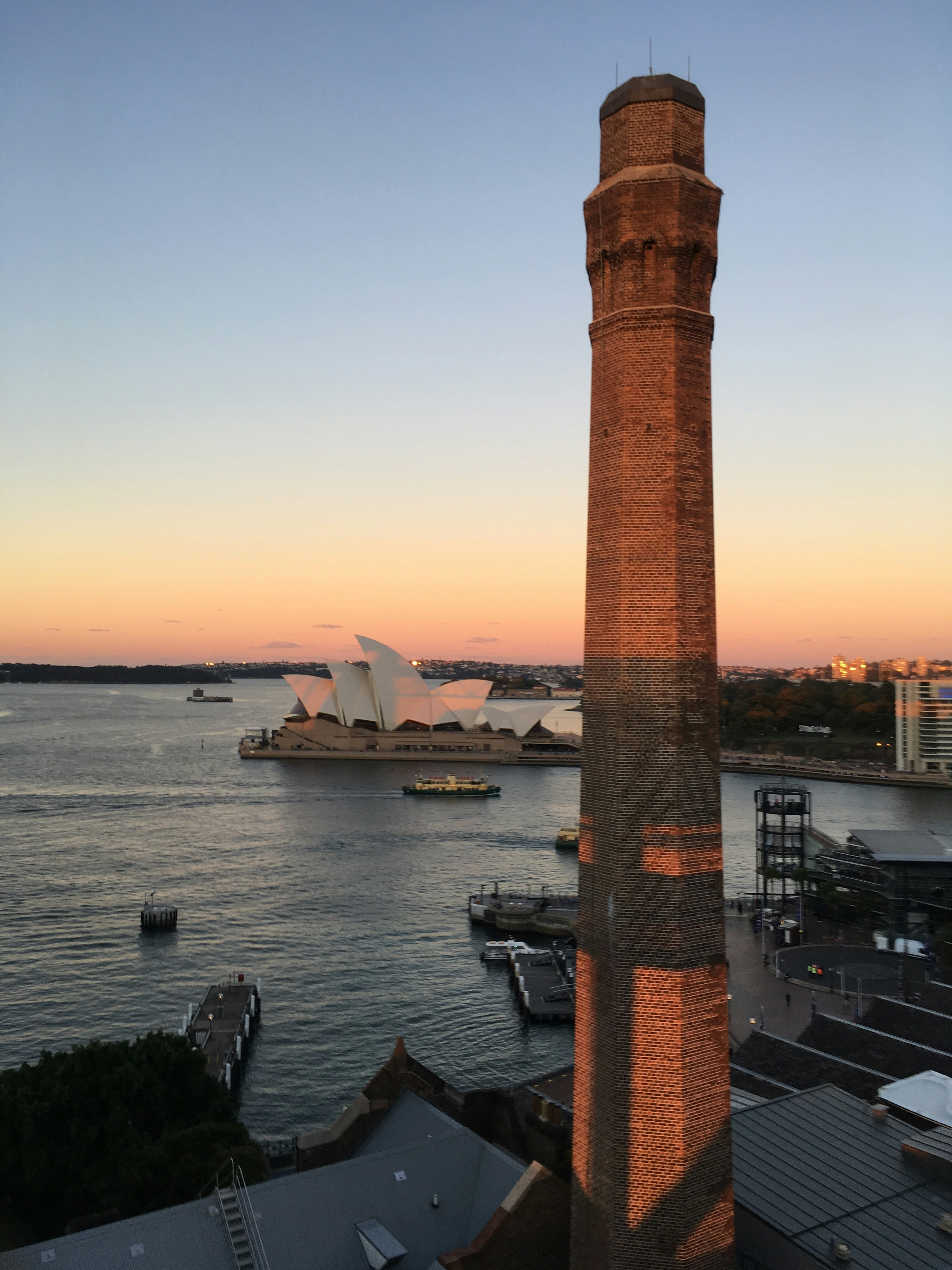 Harbor’s Brick Spire: A Twilight Over Sydney’s Waterfront