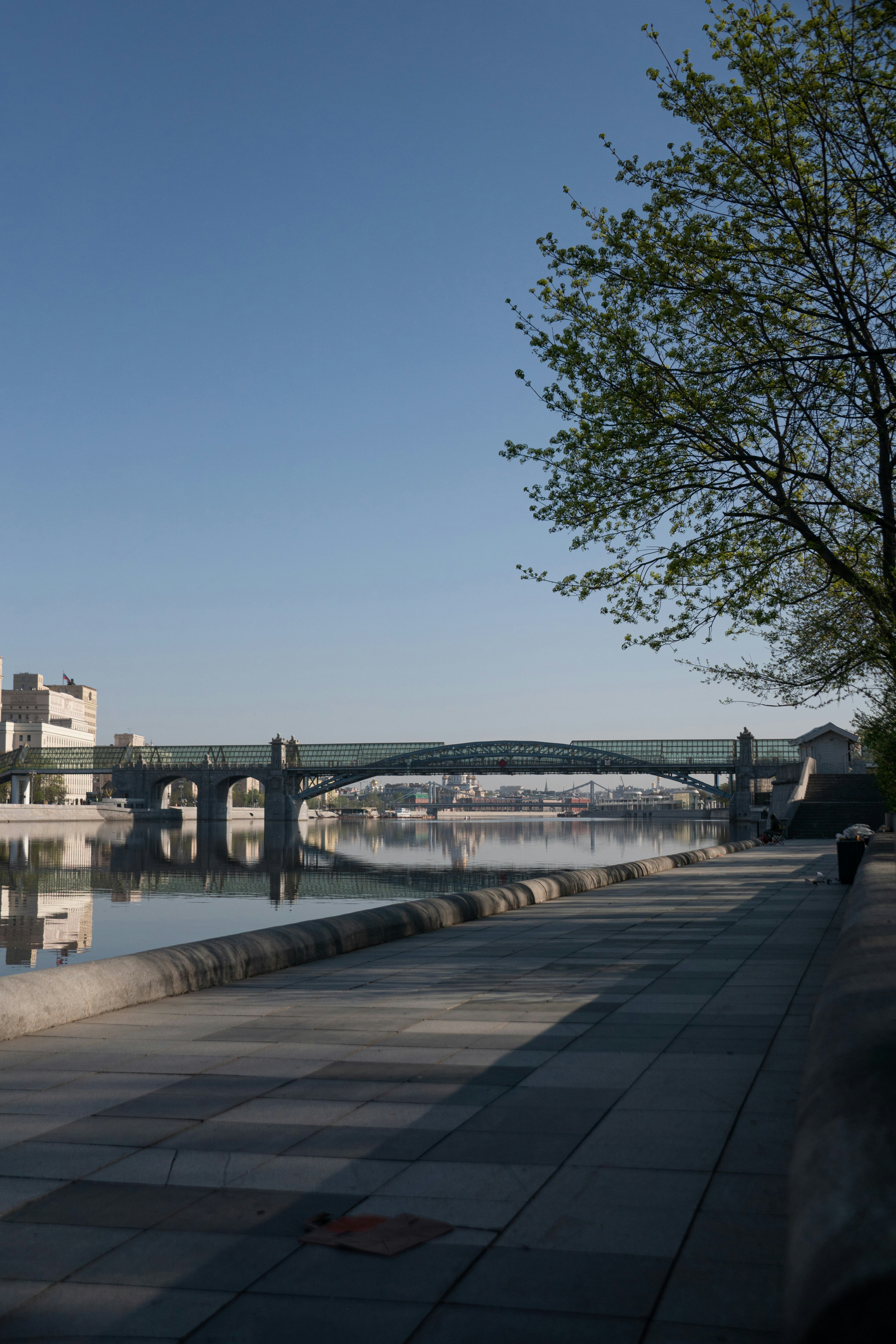 Riverside Arc Toward the Quiet Bridge