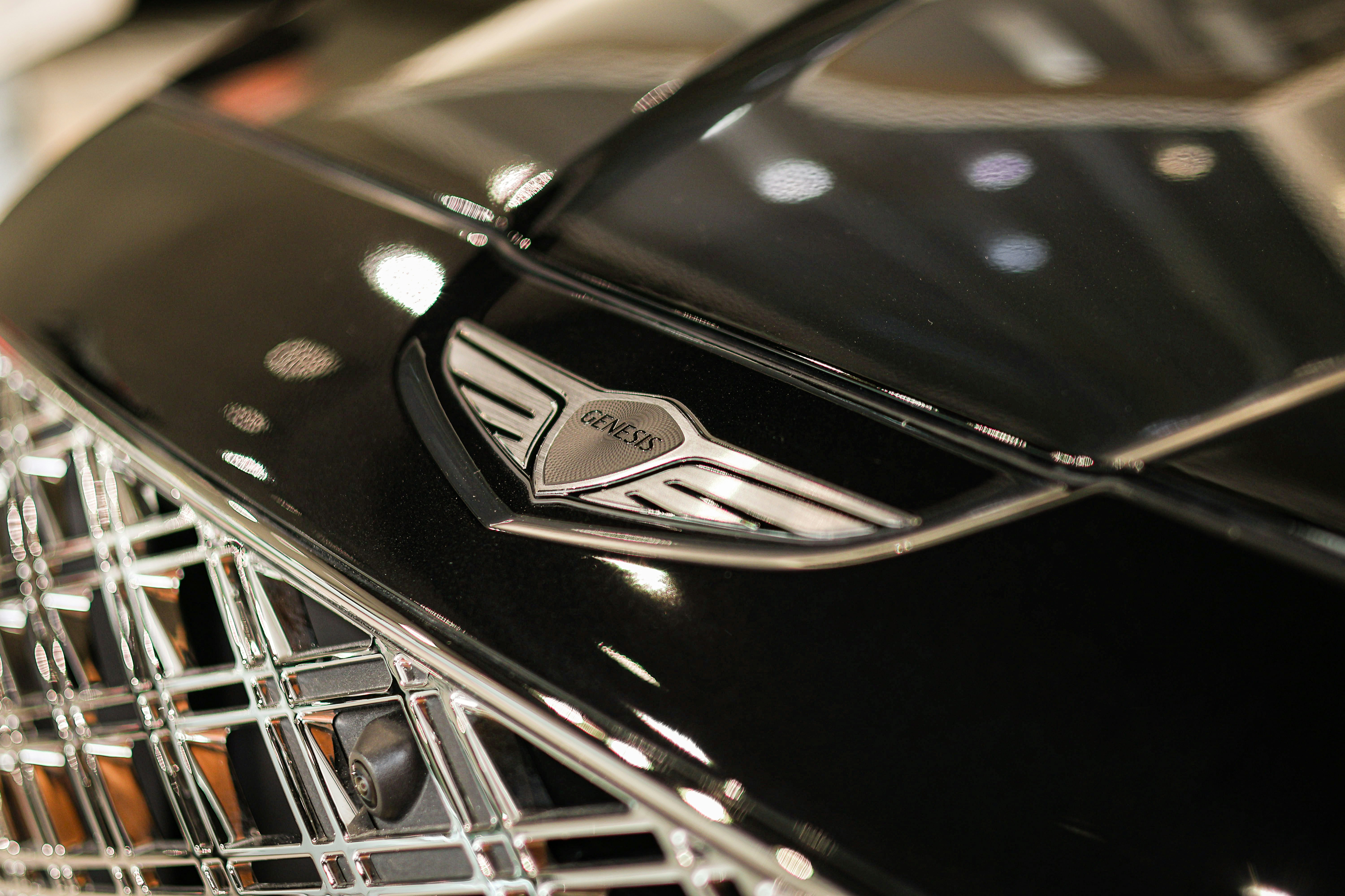 The genesis logo is displayed on the car's hood. photo – Free Luxury ...