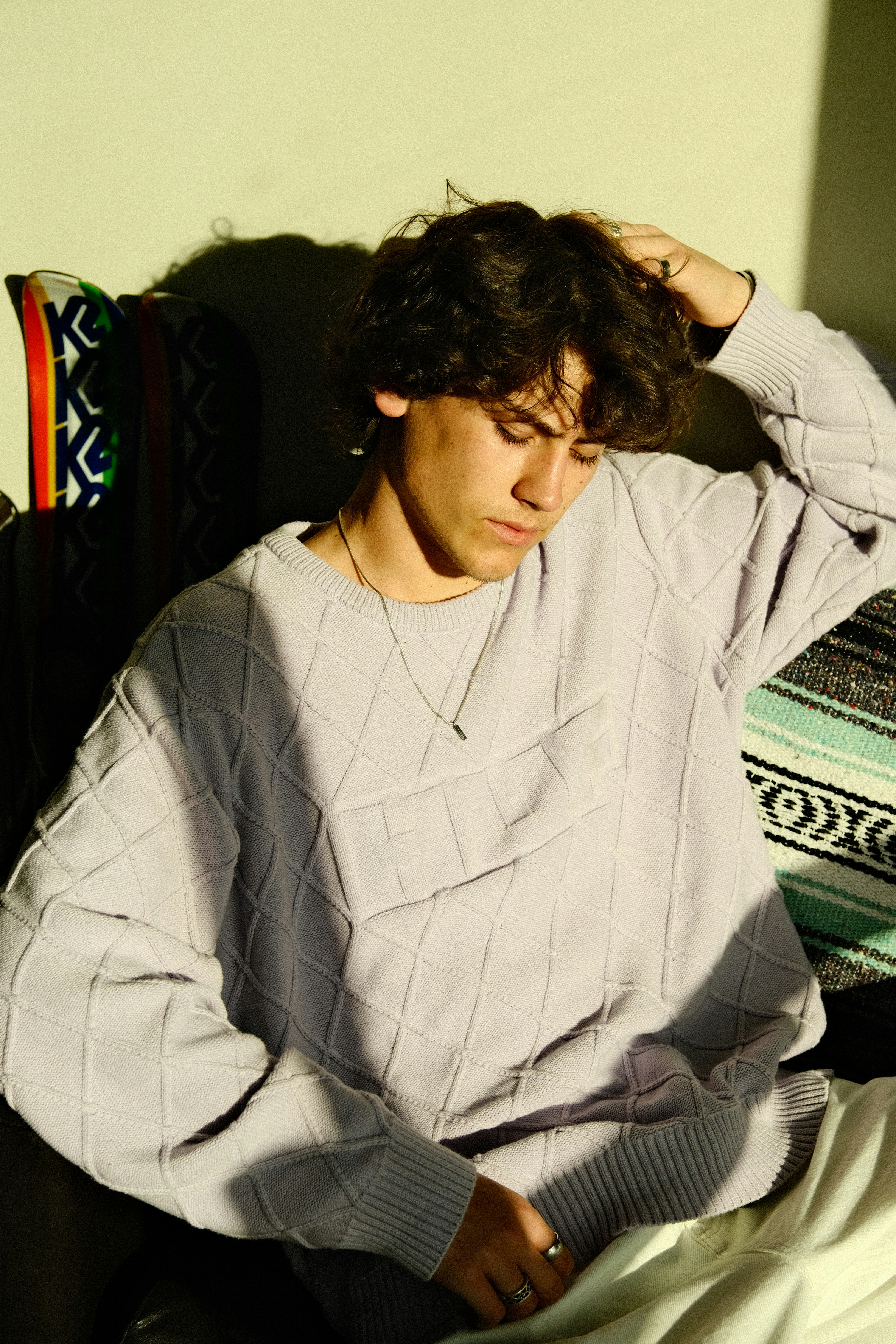 Soft Sunlit Contemplation: A Portrait on a Quiet Evening Sofa