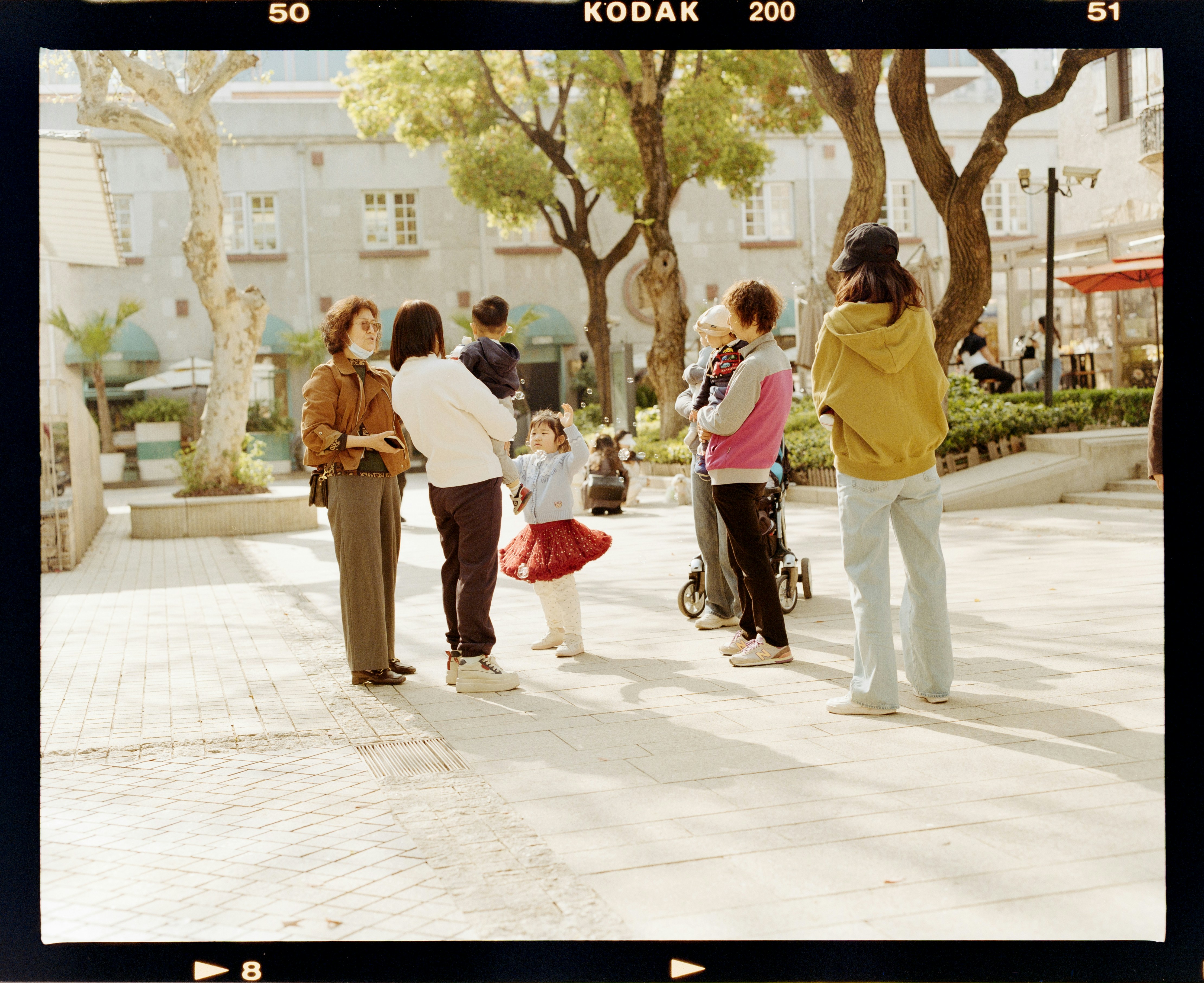 People are gathered outdoors in a sunny square. photo – Free City Image ...