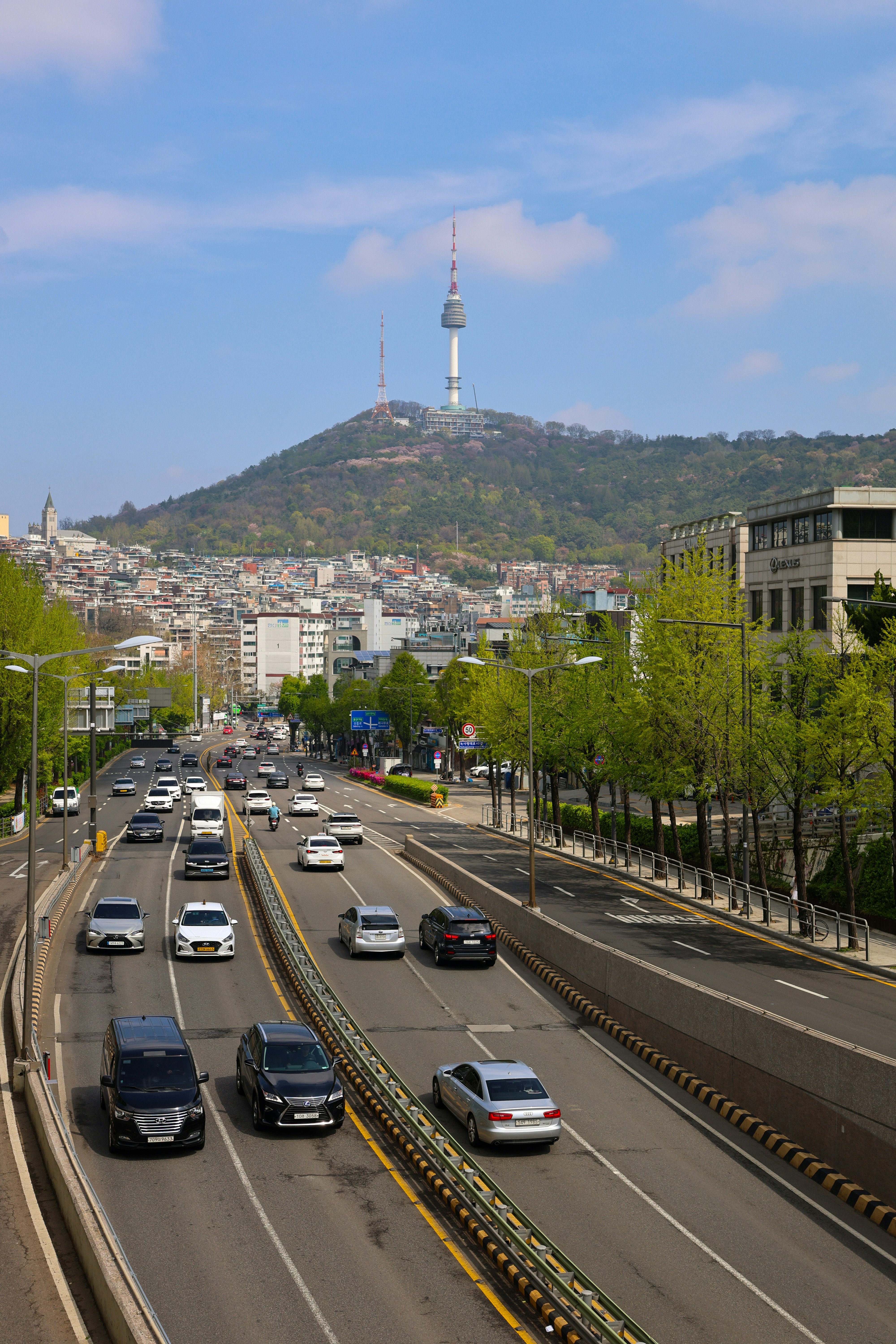 Namsan's Beacon: Hilltop Tower Over Seoul's Traffic