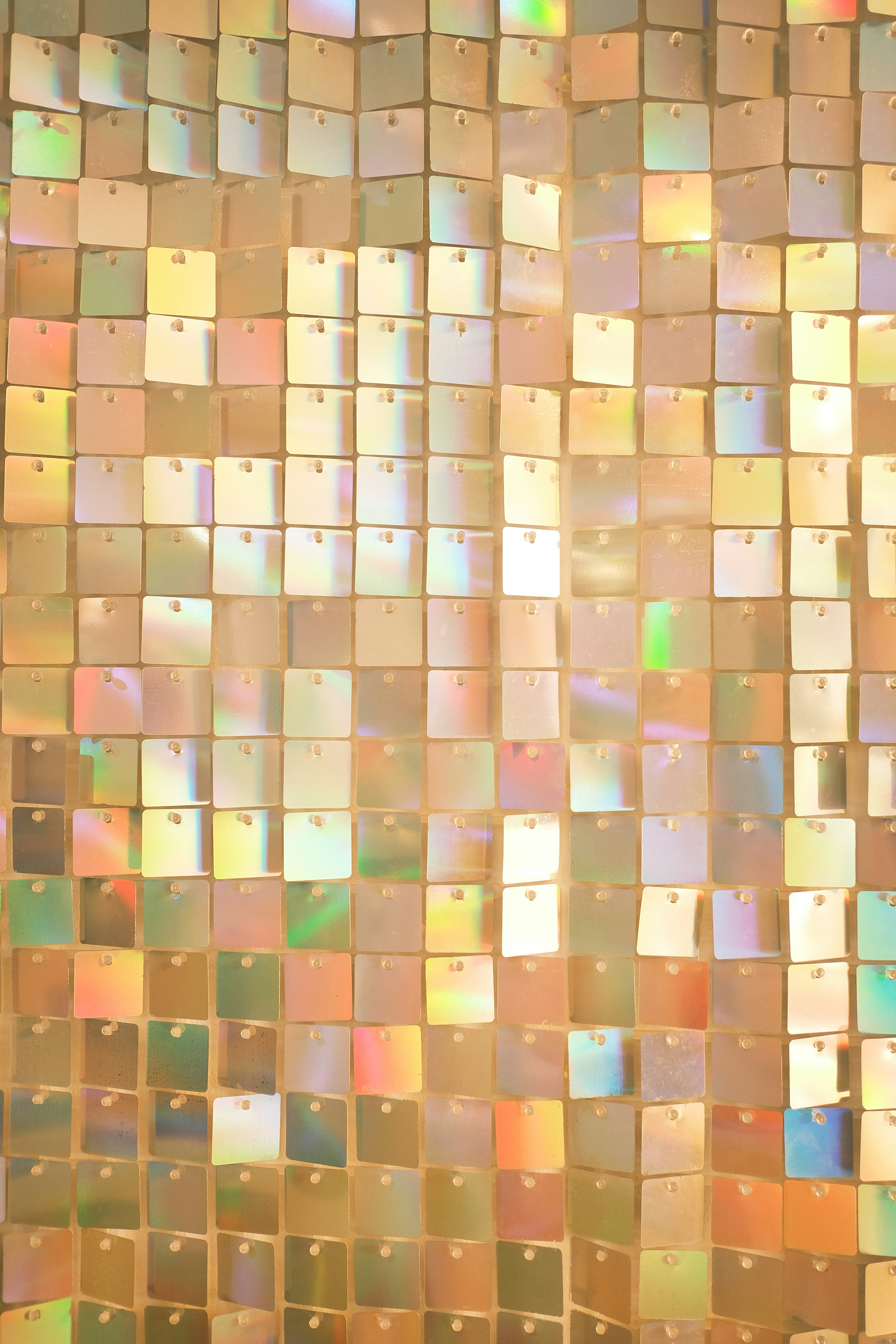 Sequined squares form a shimmering, reflective background. photo – Free ...