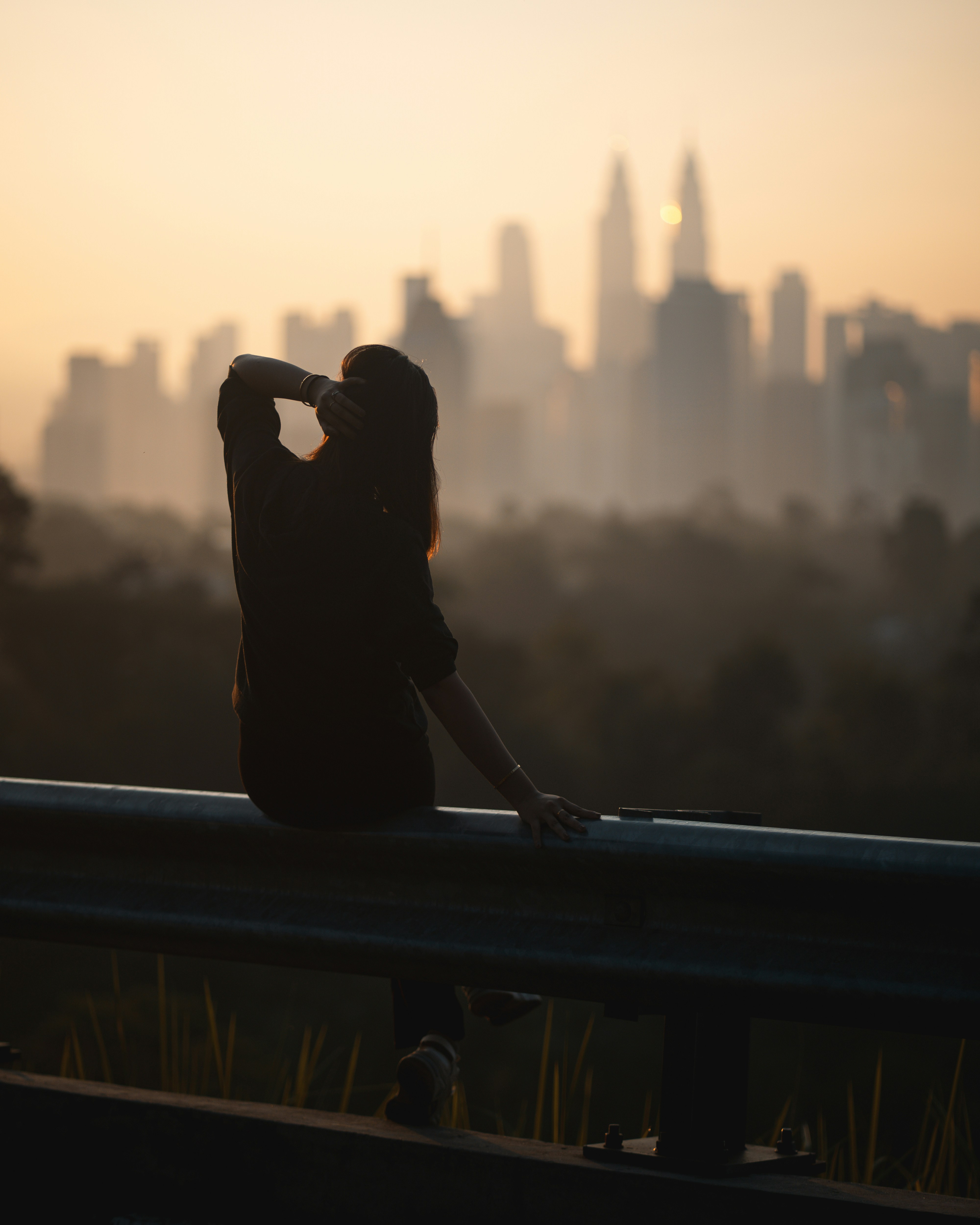  silhouette against a distant skyline at sunset
