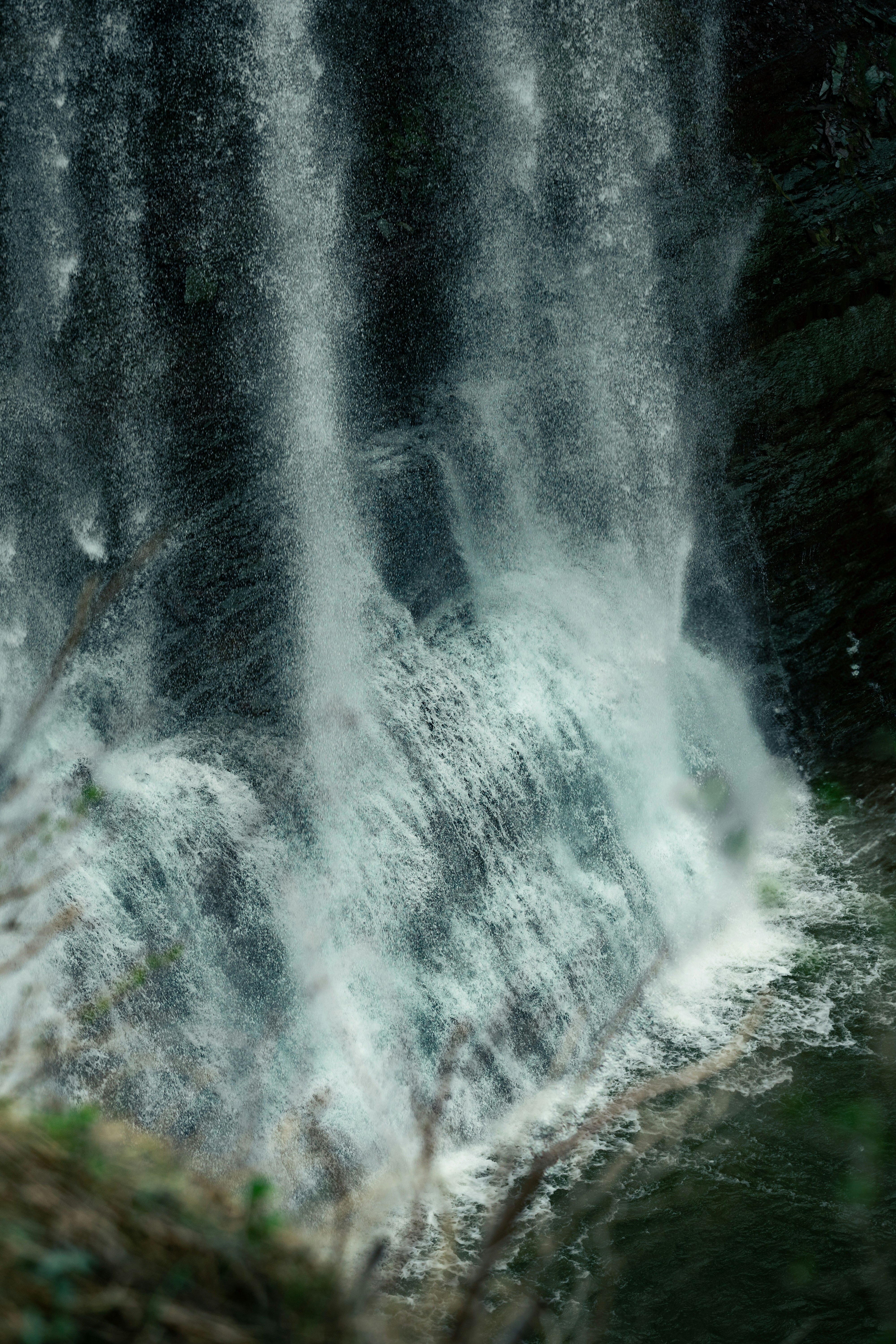 Mist-stitched Cascade in a Shadowed Gorge