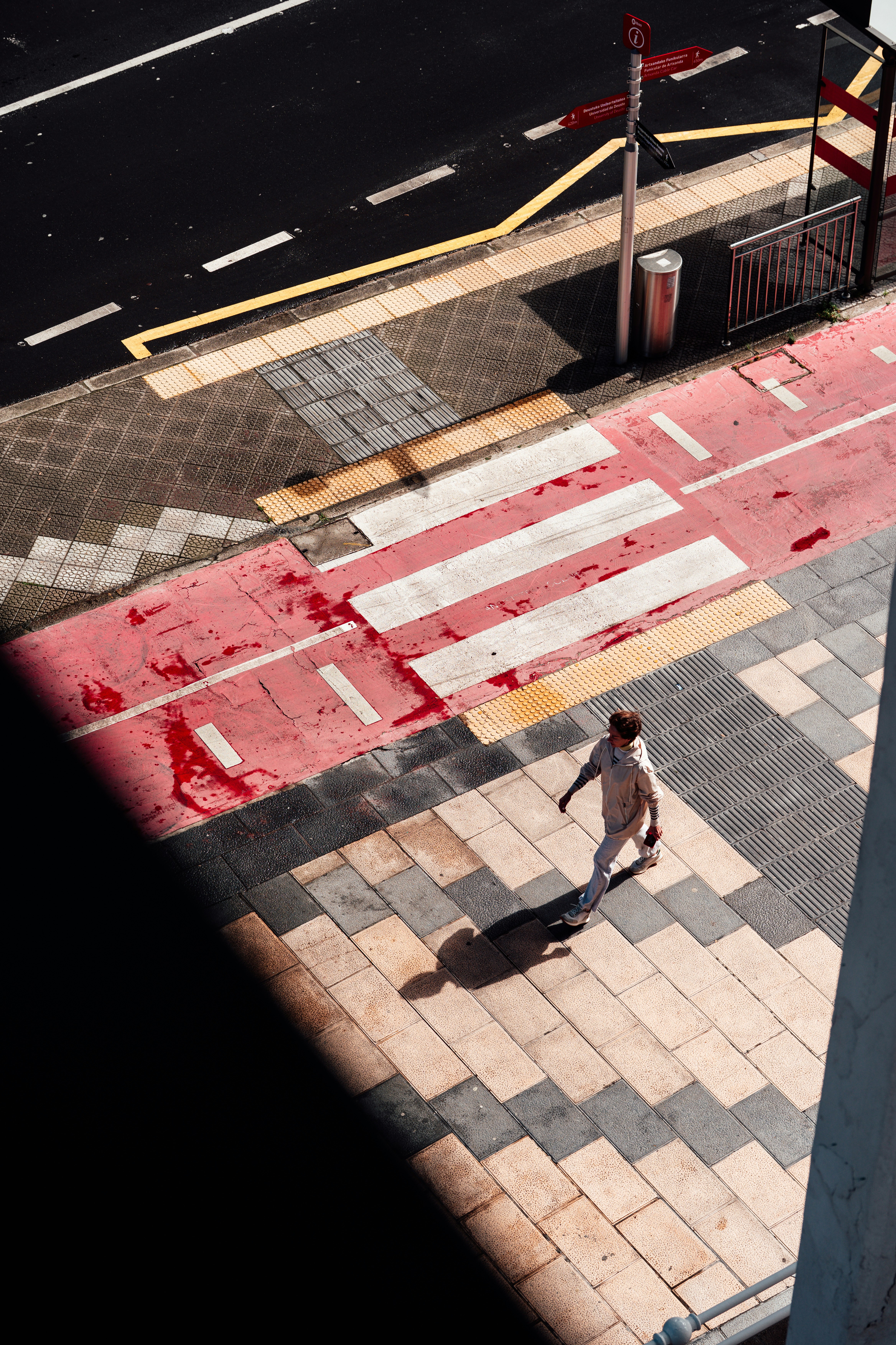 A person walks across a colorful crosswalk. photo – Free Street ...