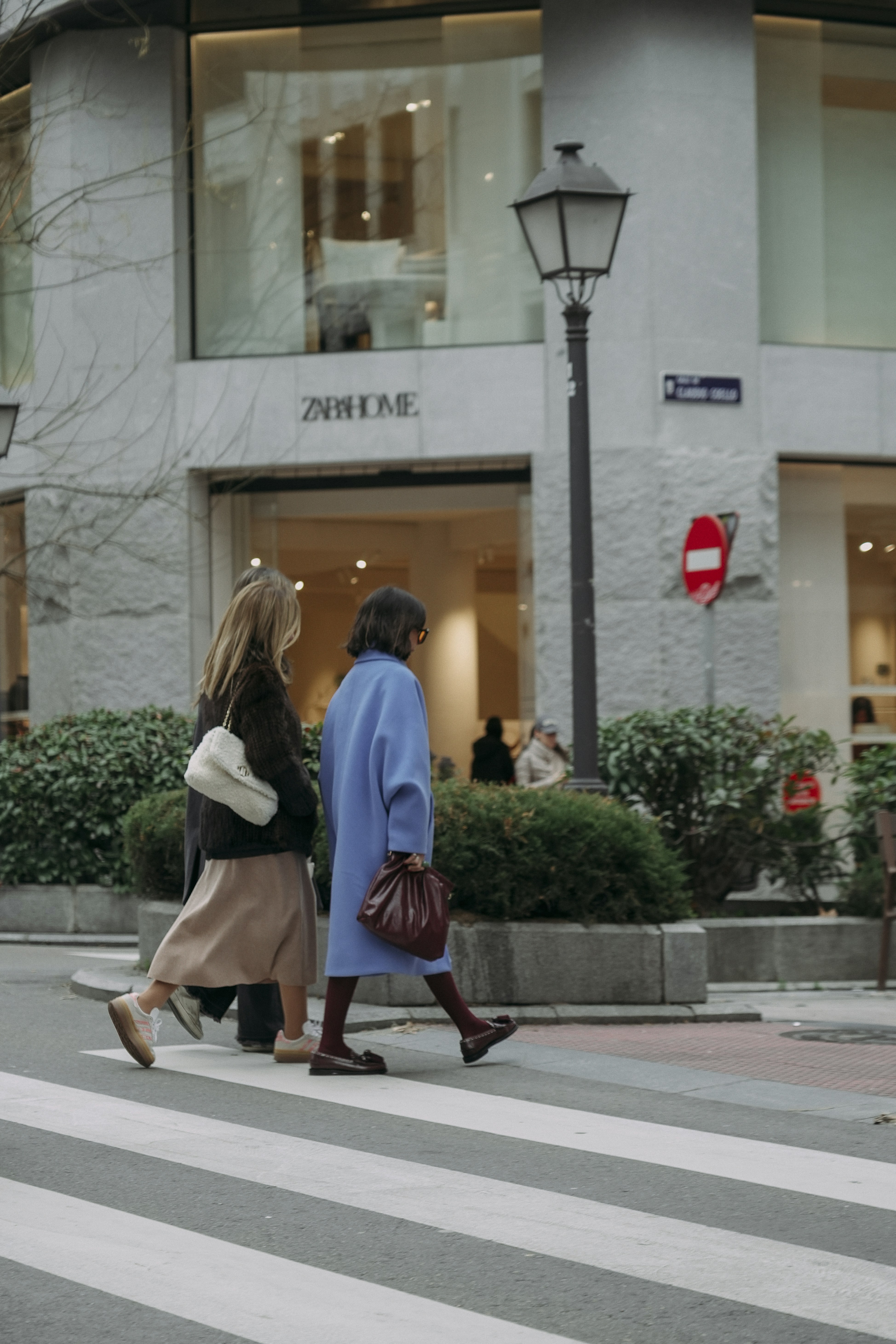 Blue Coat Crossing: A City Moment Outside Zara Home