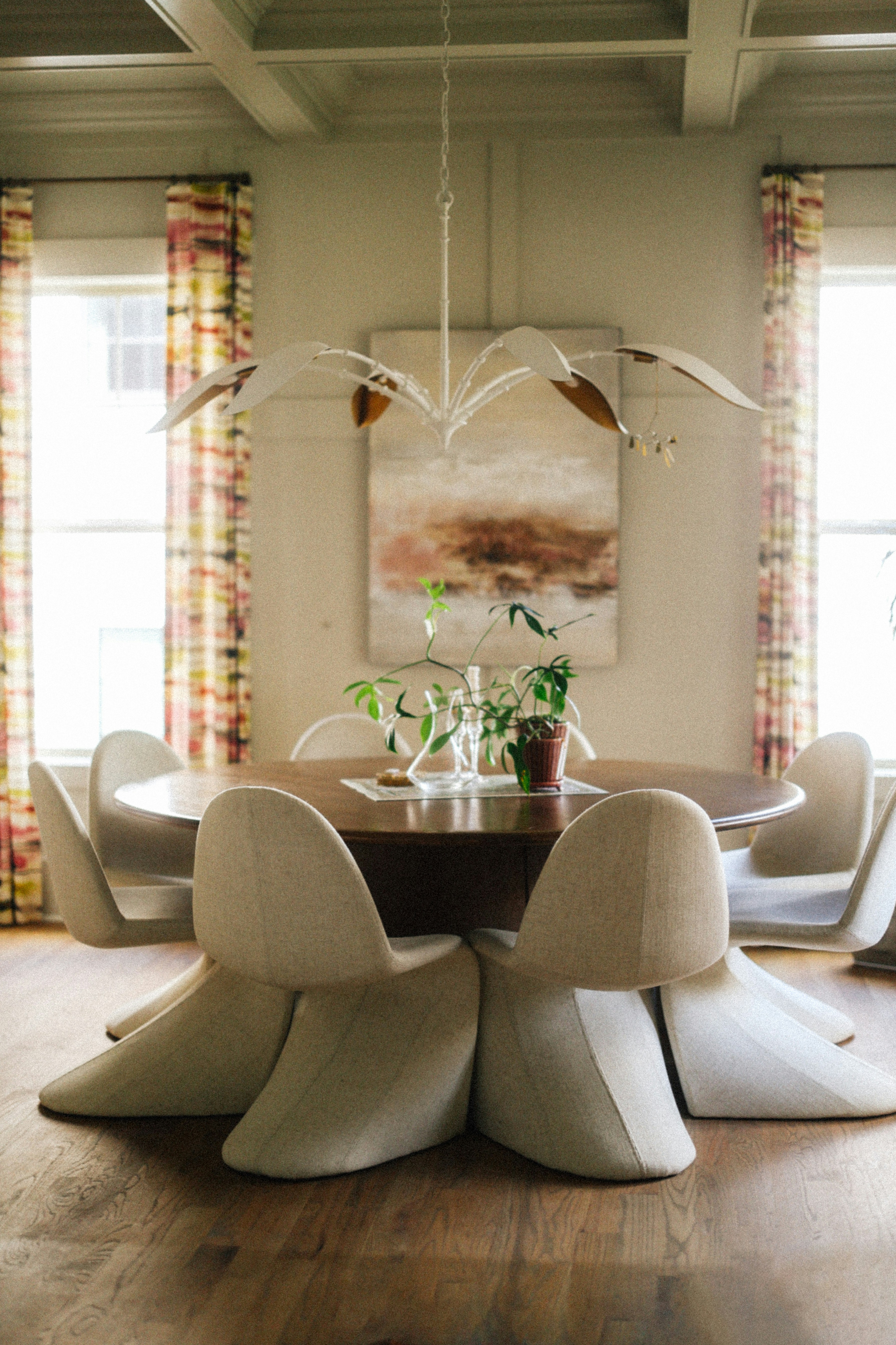 Stylish dining room featuring a unique light fixture. photo – Free ...