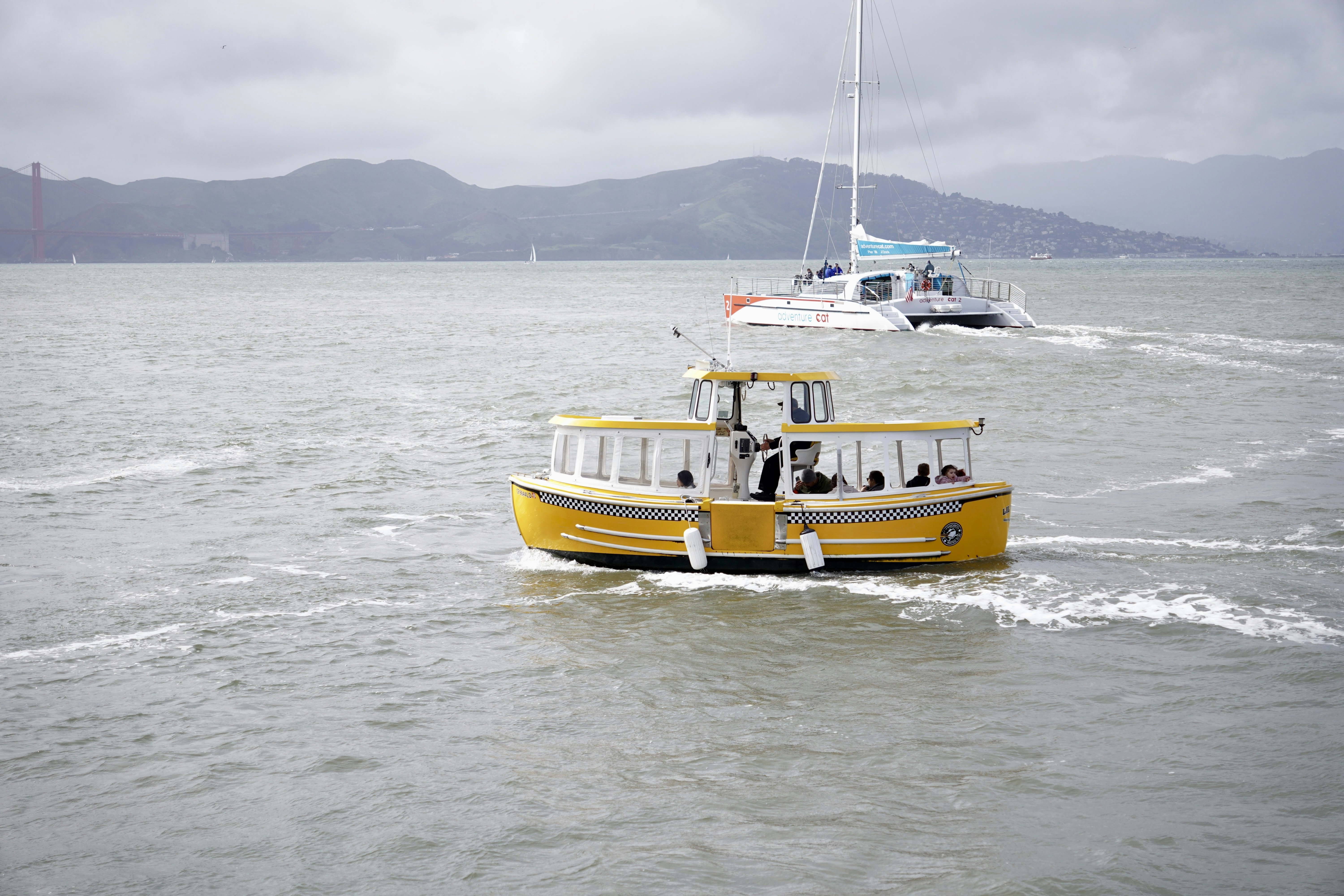 Yellow Harbor Pilot: A Bright Boat Cut Across Grey Seas