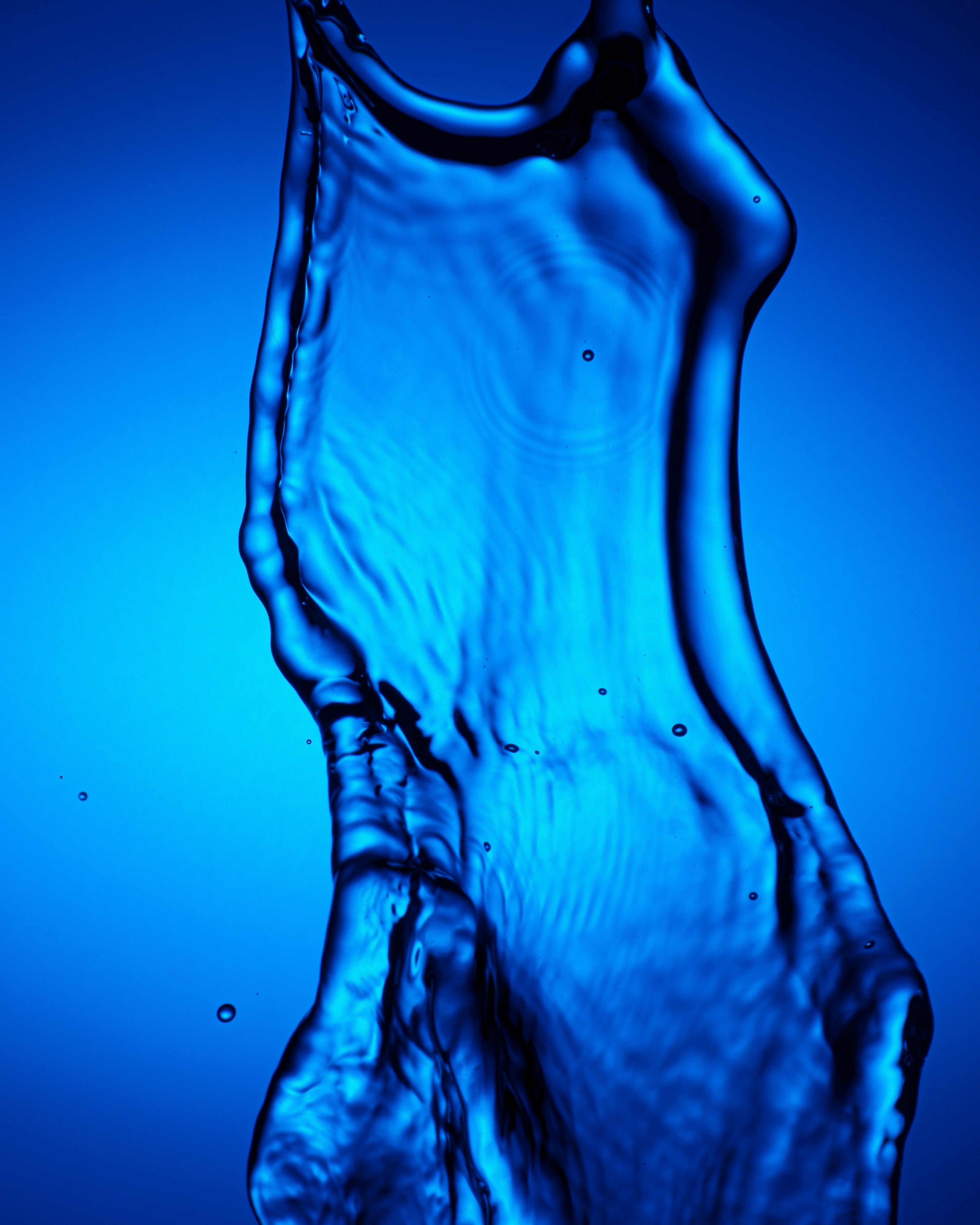 Water is splashing against a blue background. photo – Free Abstract ...