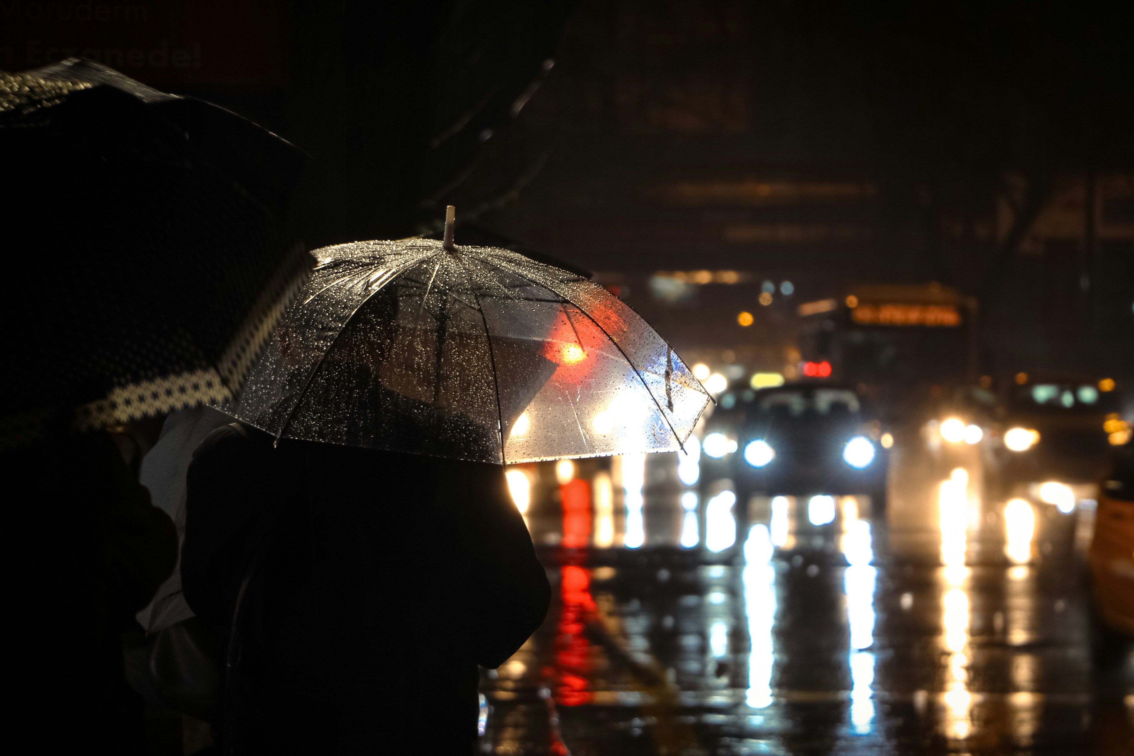 Rainy night scene with umbrellas and traffic. photo – Free Light Image ...