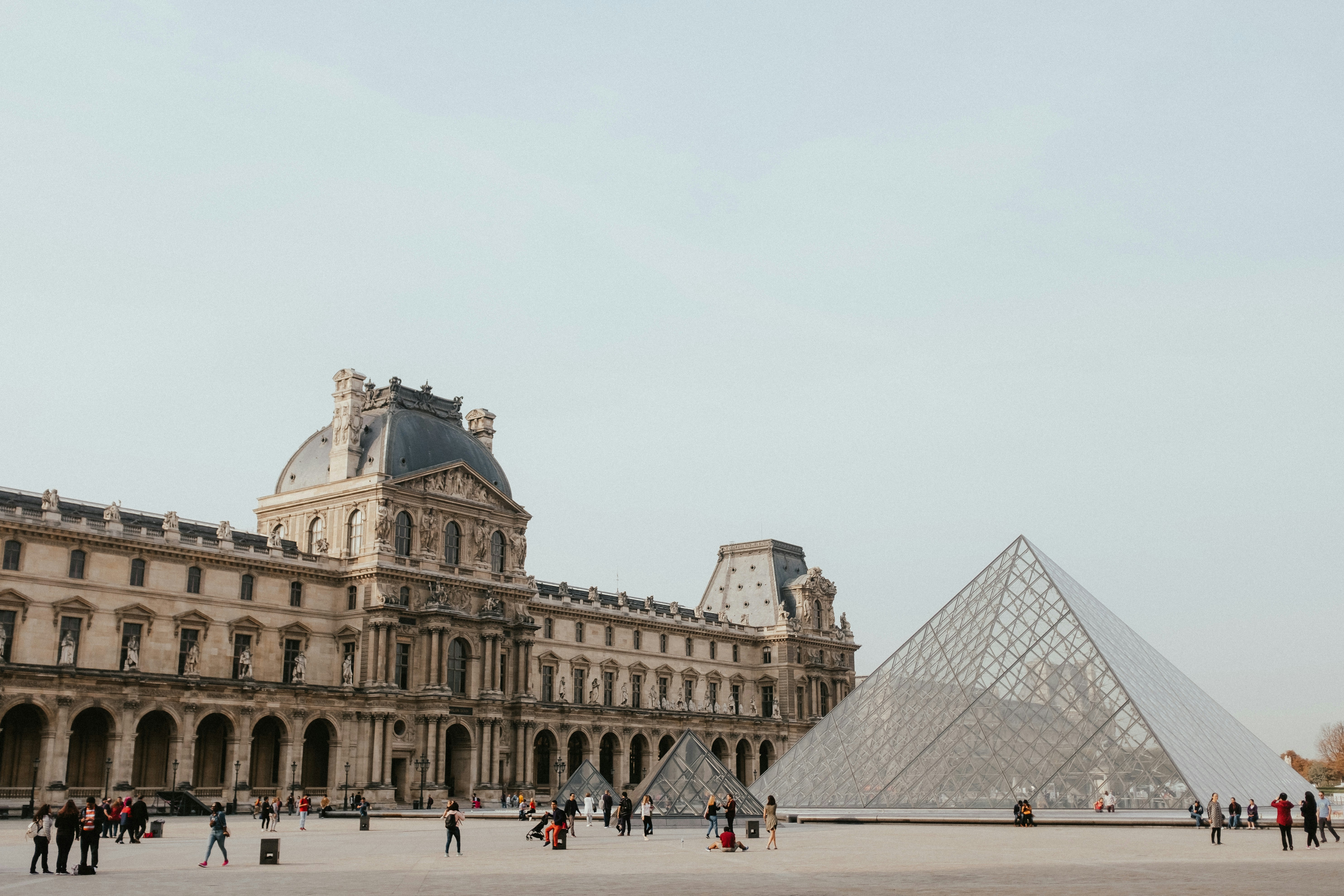 The louvre museum and its iconic glass pyramid. photo – Free Paris ...