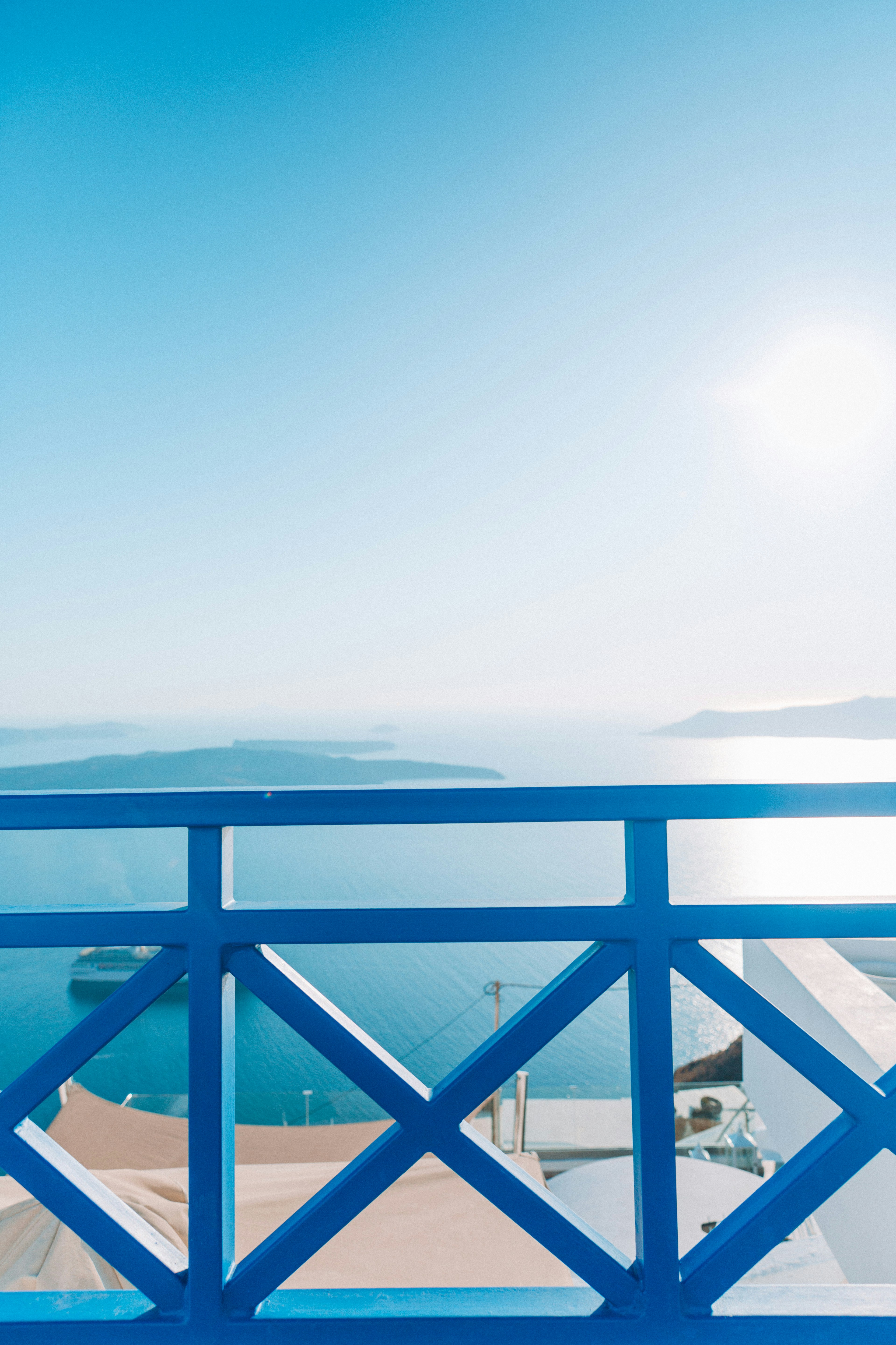 Blue railing overlooks the stunning greek coastline. photo – Free Beach ...