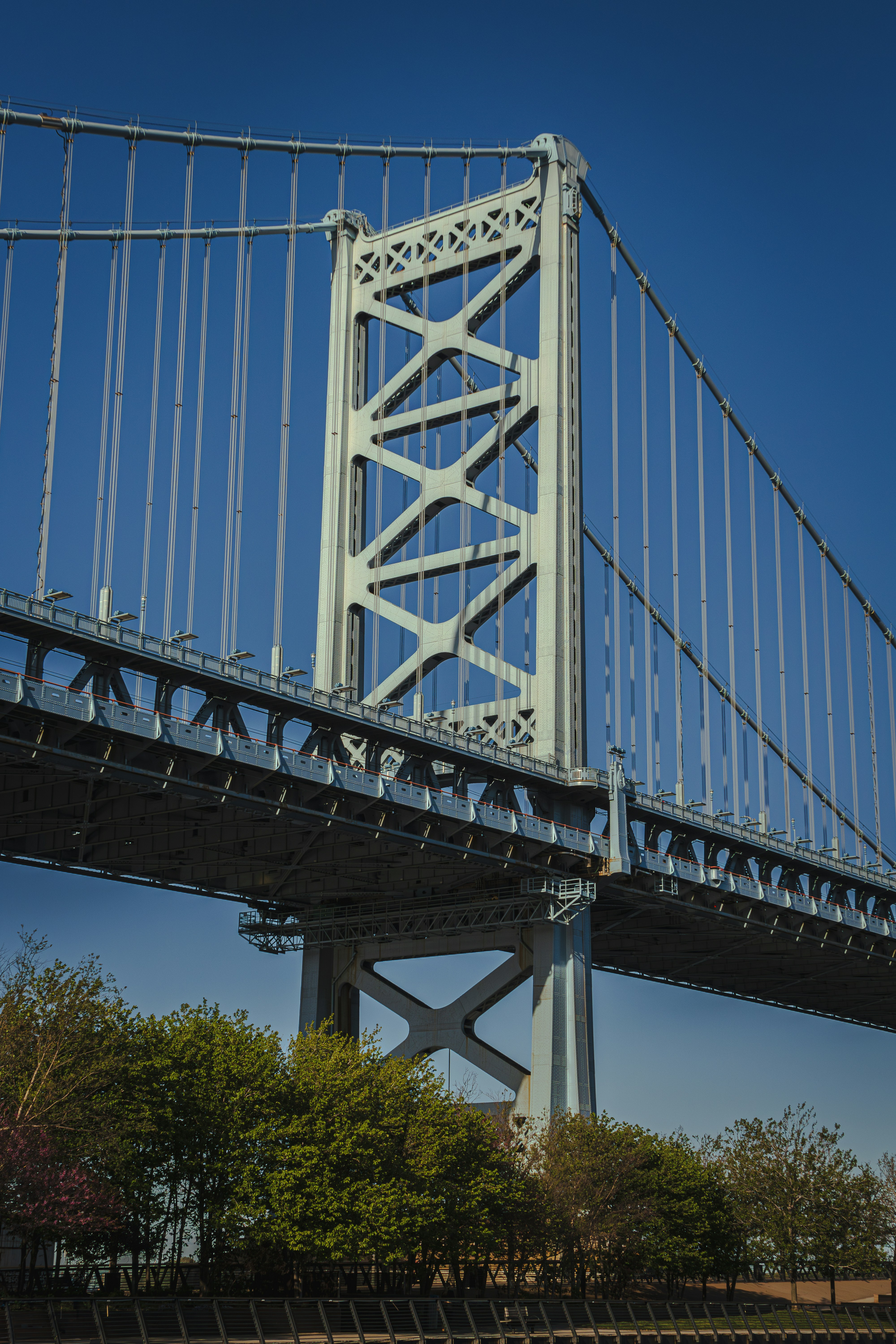 A tall bridge rises into a bright blue sky. photo – Free Architecture ...