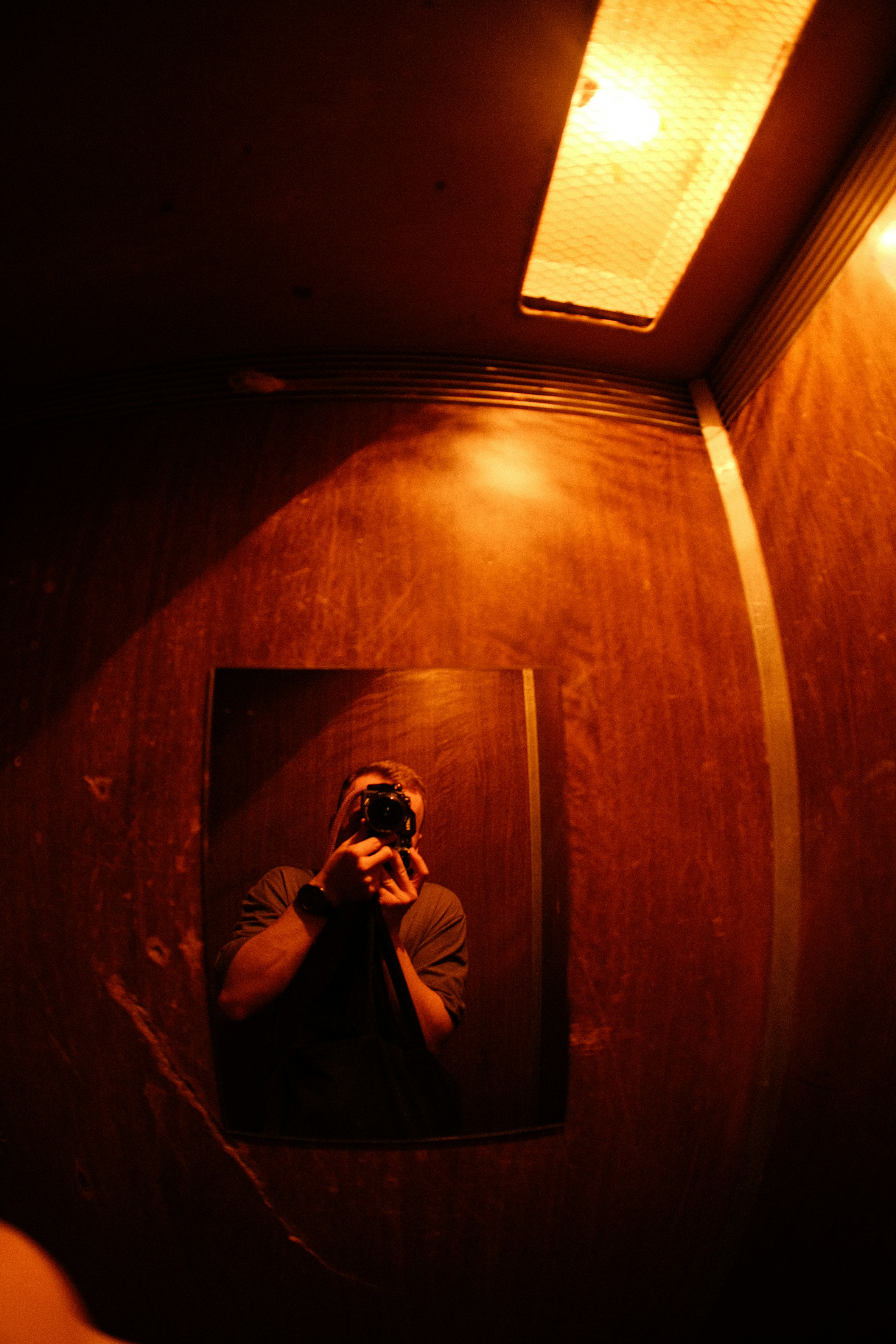 Amber Elevator Reflections: A Quiet Self-Portrait