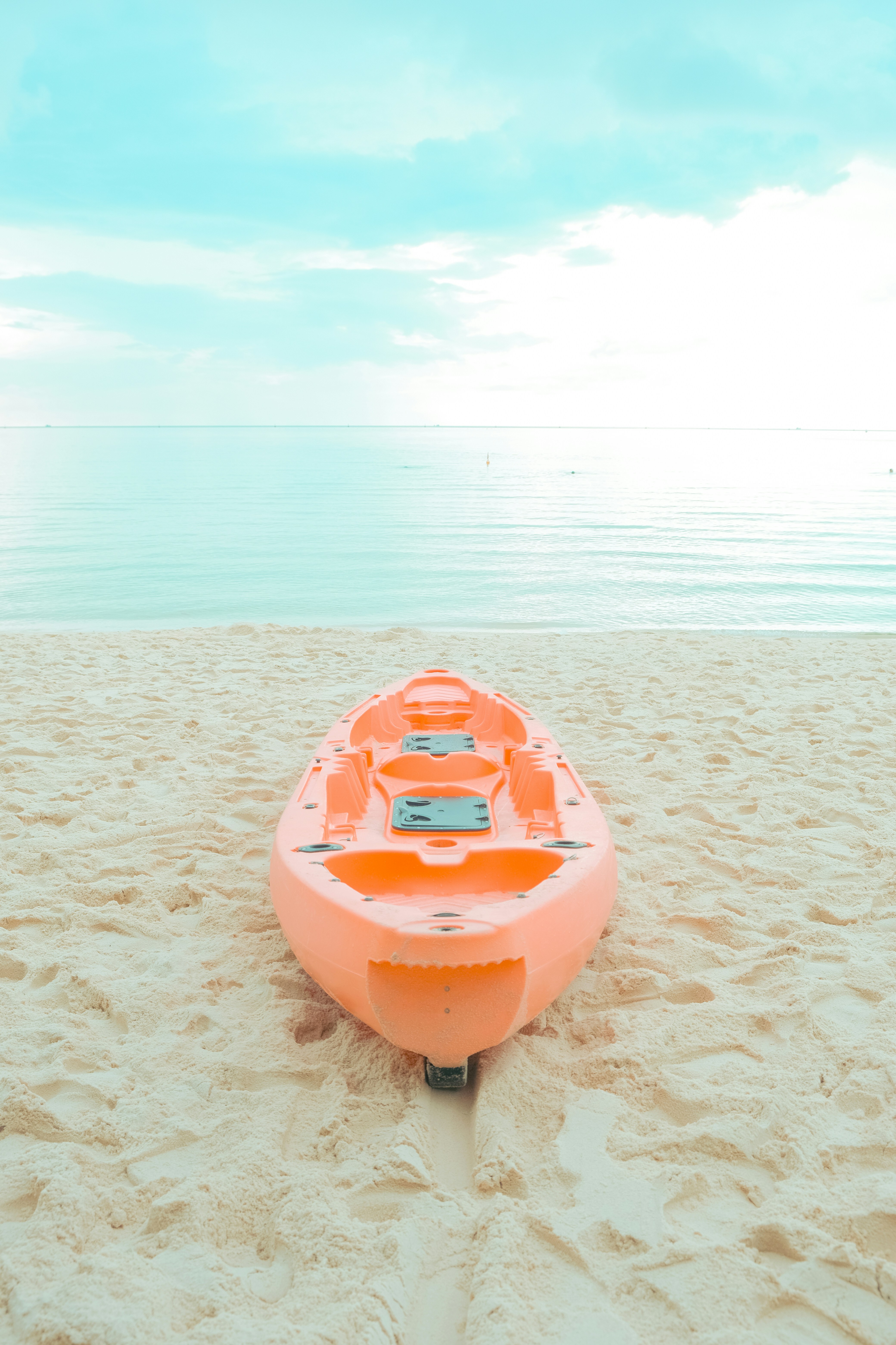 Orange Boat on Quiet Beach: A Centered Dawn on Soft Sand