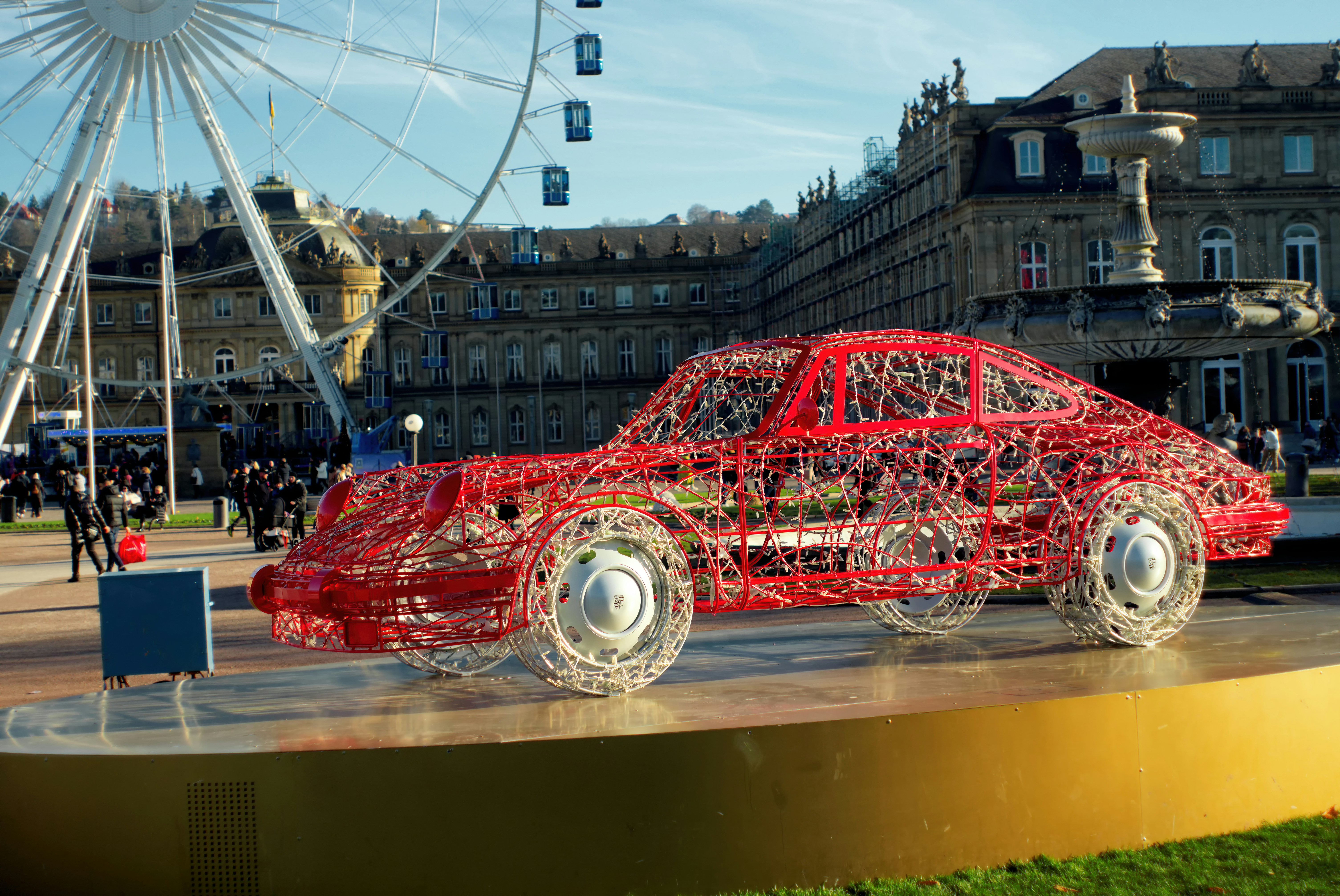 Red Wireframe Car on a Sunlit Plaza
