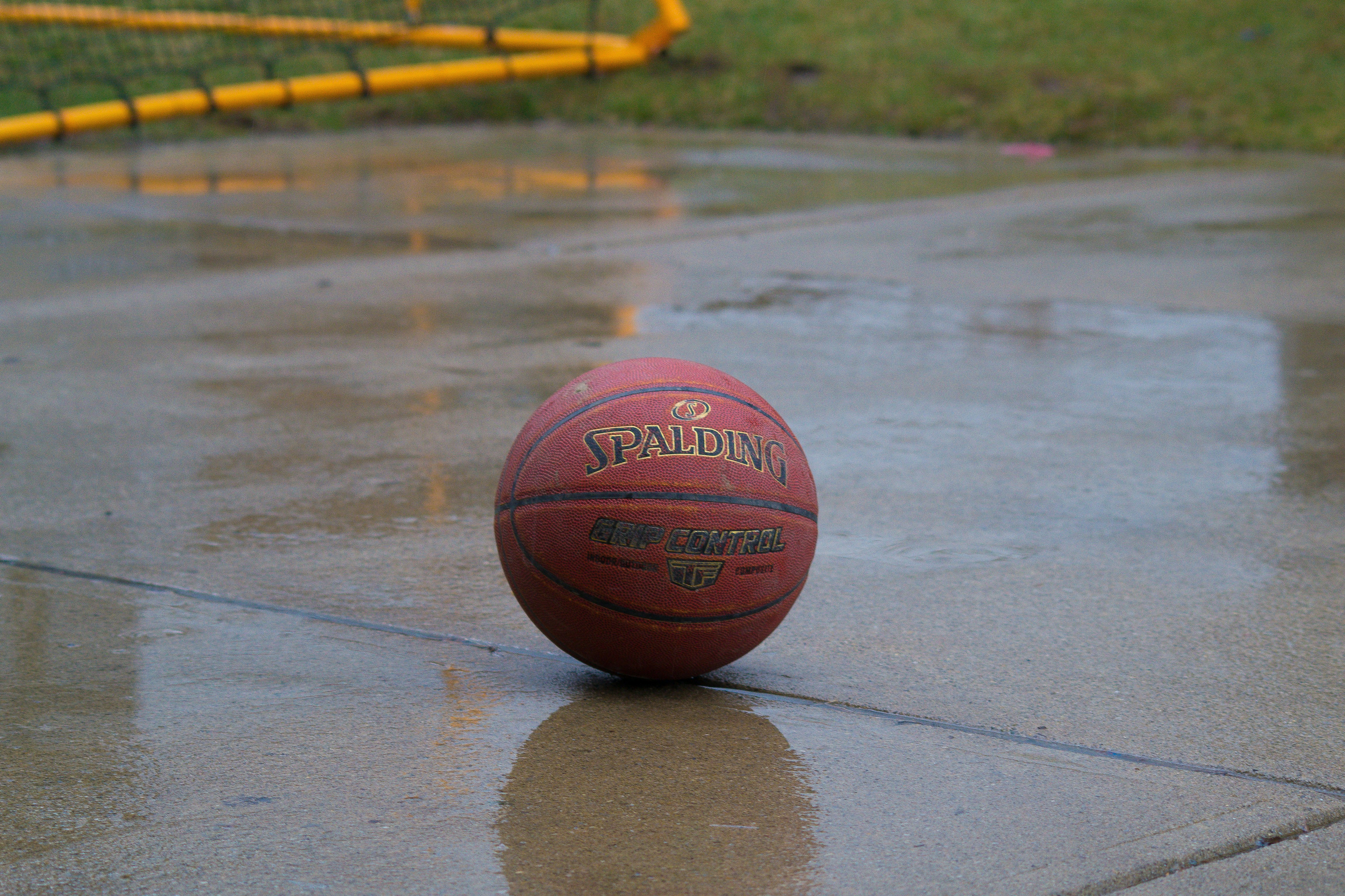 Echoes of Play: A Rain-Soaked Basketball