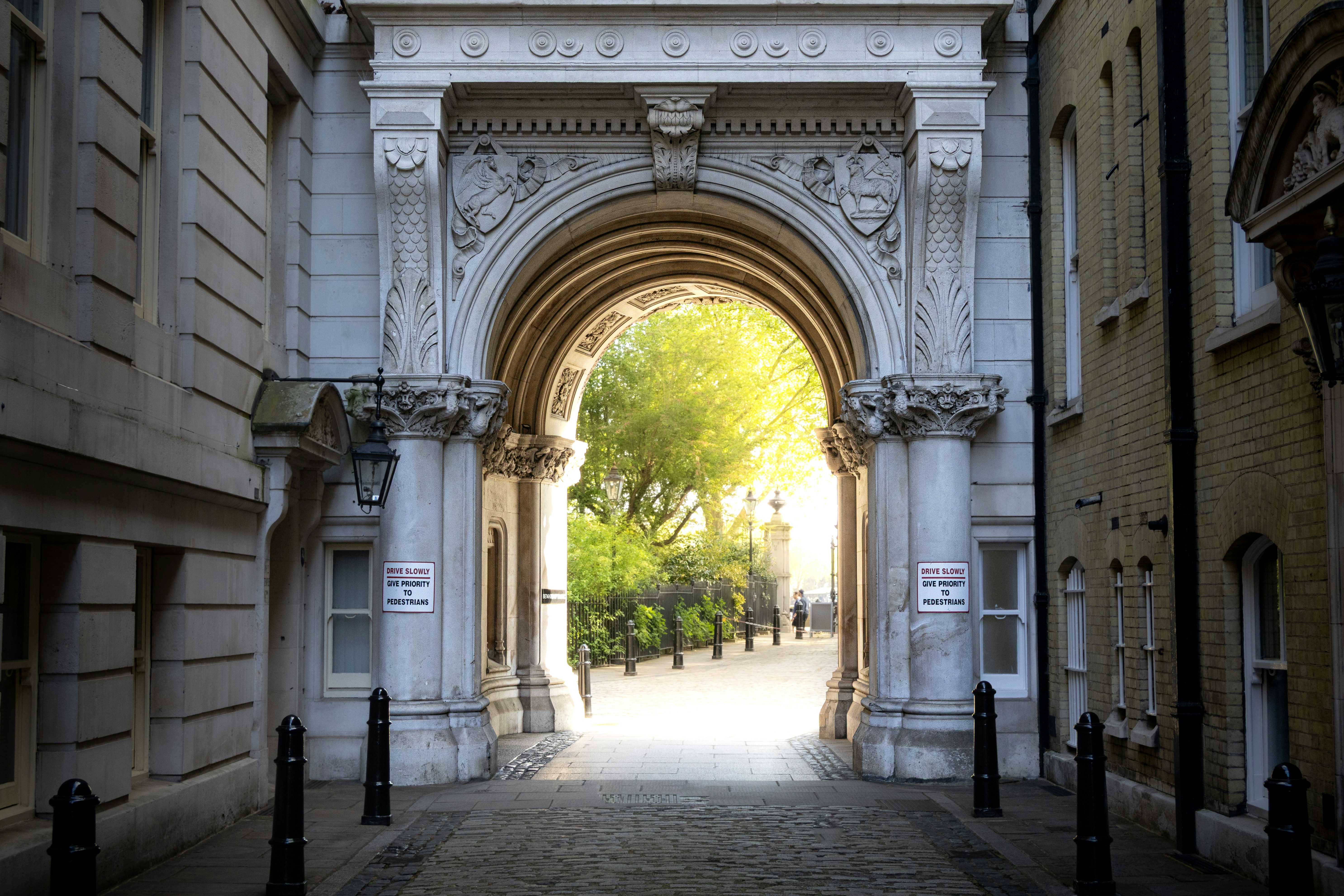 Light Beyond the Arch: A Silent Gateway to a Sunlit Lane