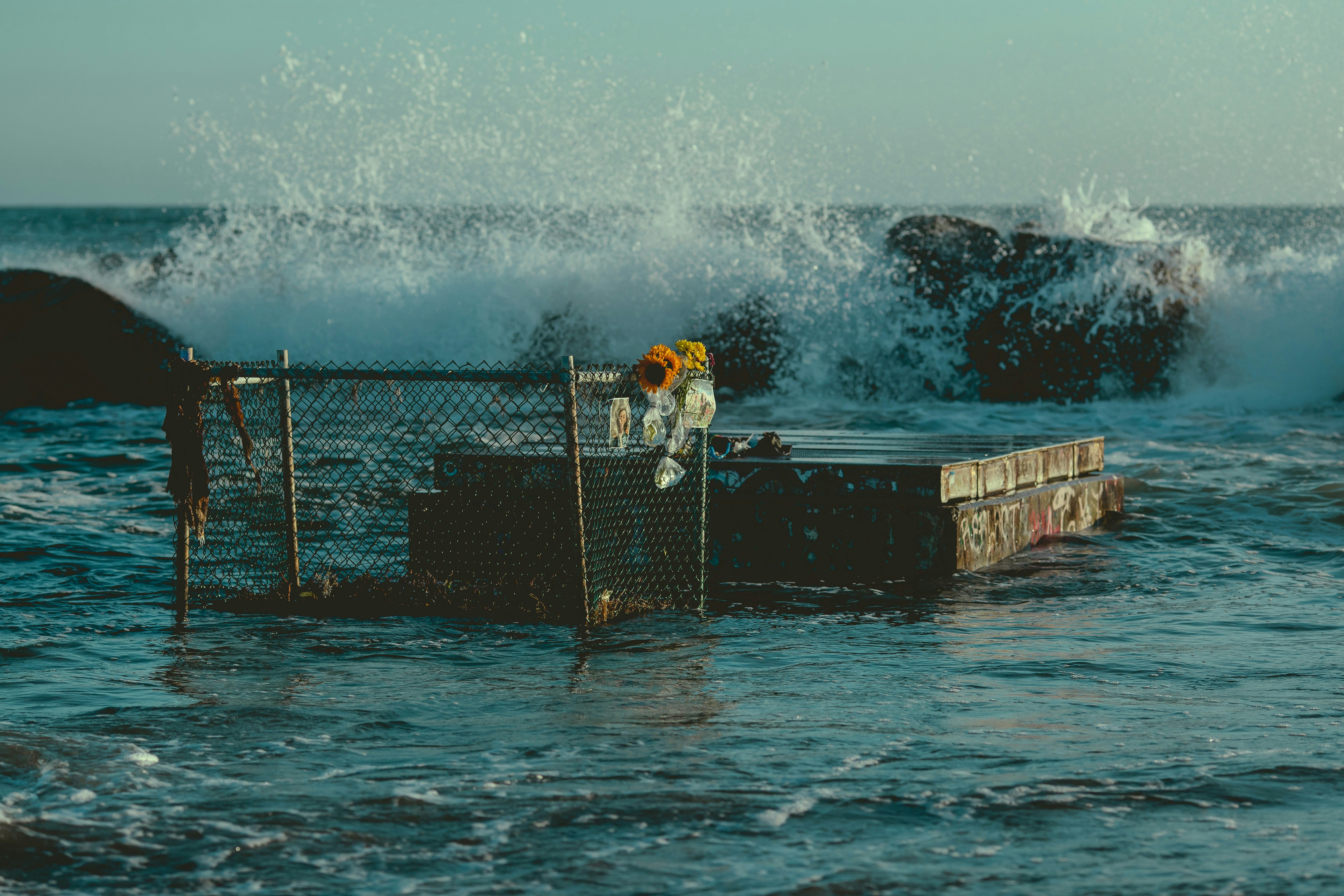 Waves crash onto a dock in the ocean. photo – Free Wallpaper Image on ...
