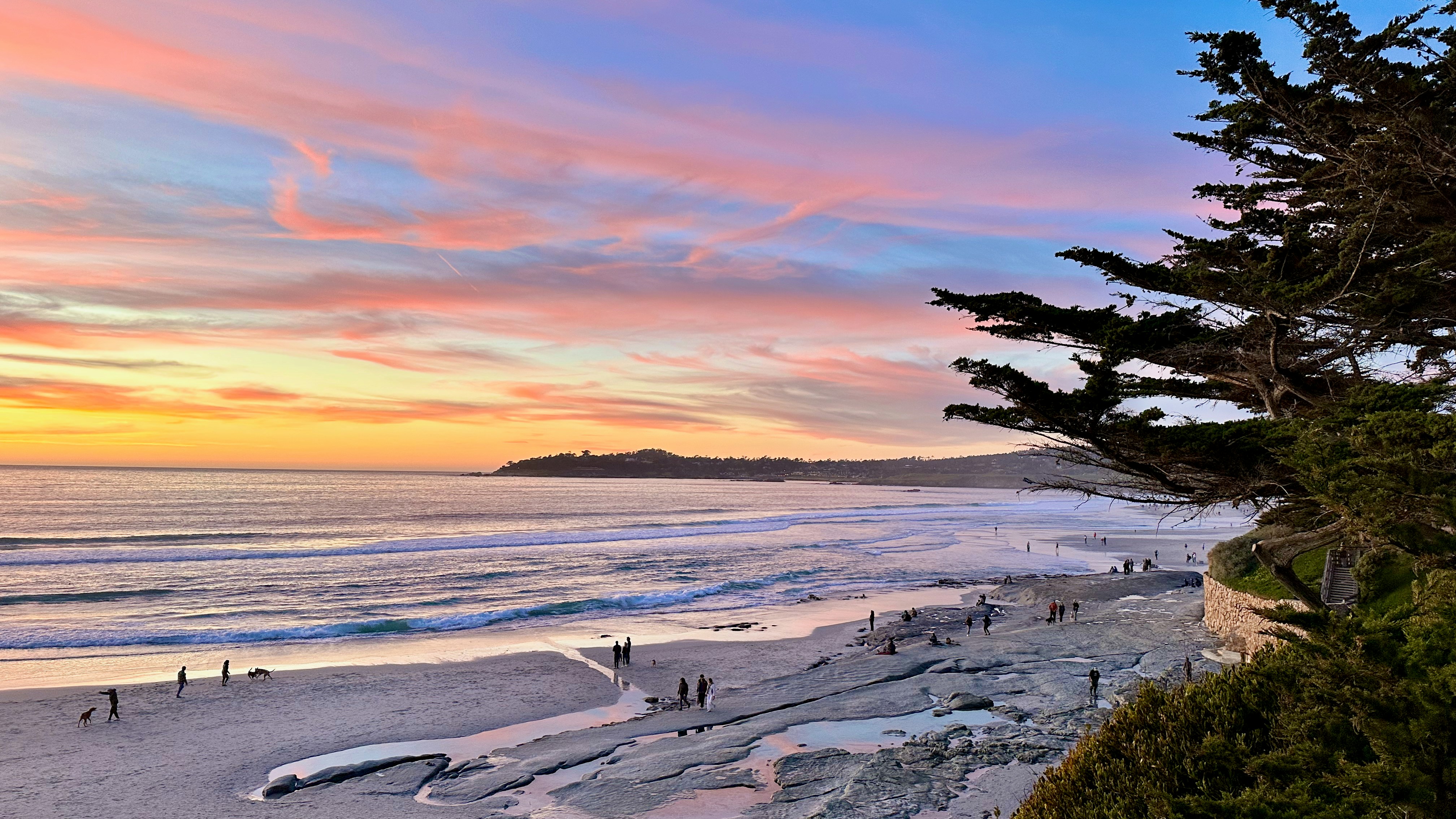 Crimson Horizon over a Wind-Kissed Beach and Pines