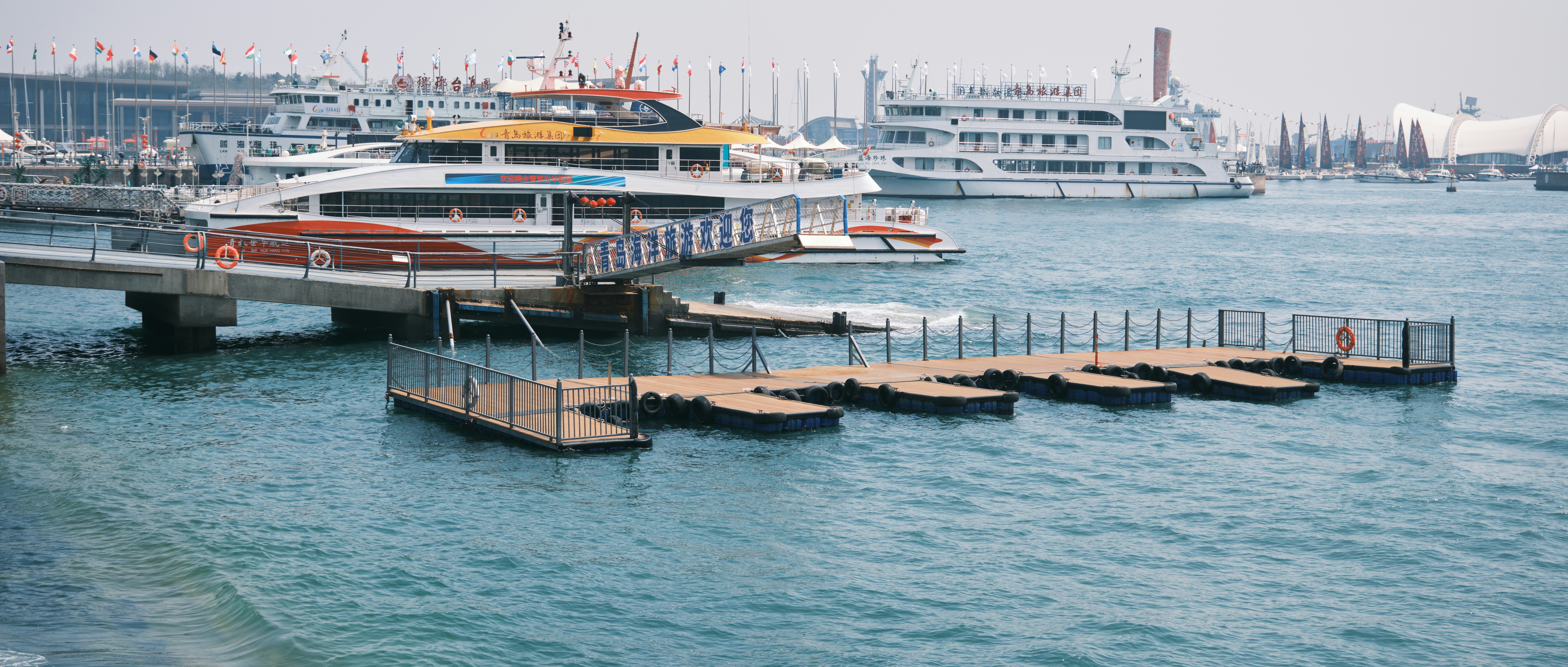Dockside Parade: Boats, Flags, and Marina Lines