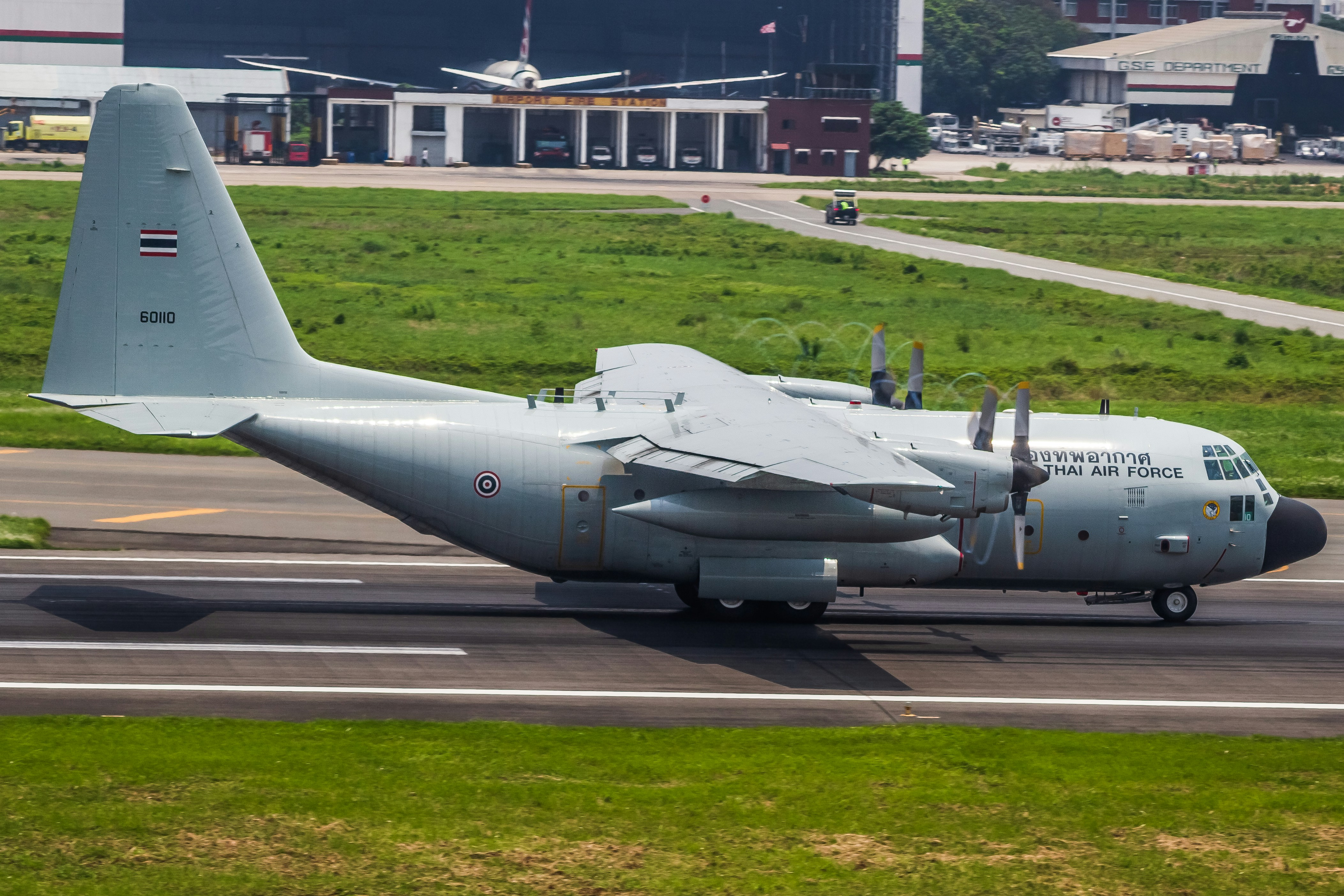 An air force c-130 hercules aircraft on a runway. photo – Free Military ...