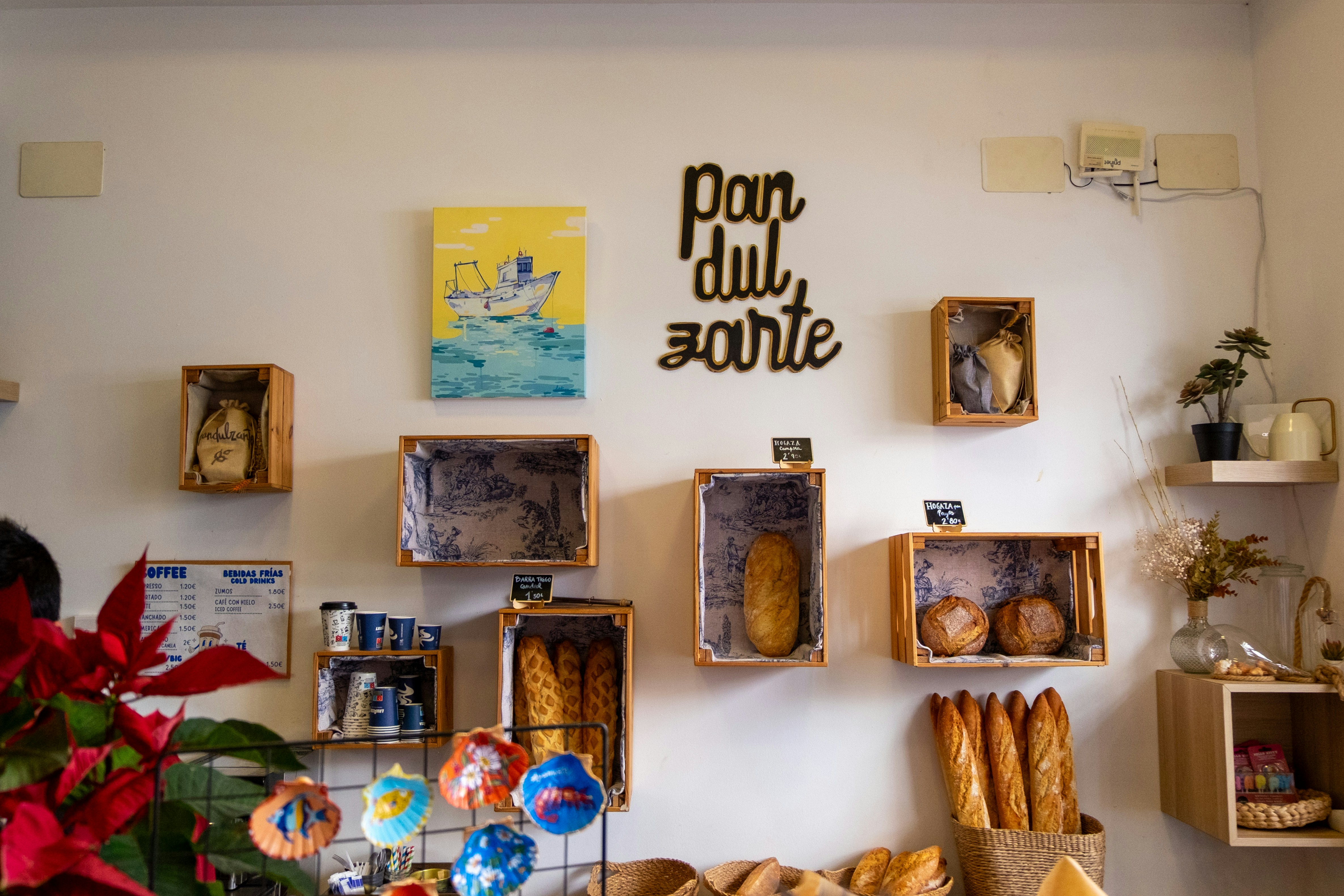 Crate-Walled Bakery: Rustic Loaves Beneath a Handwritten Sign