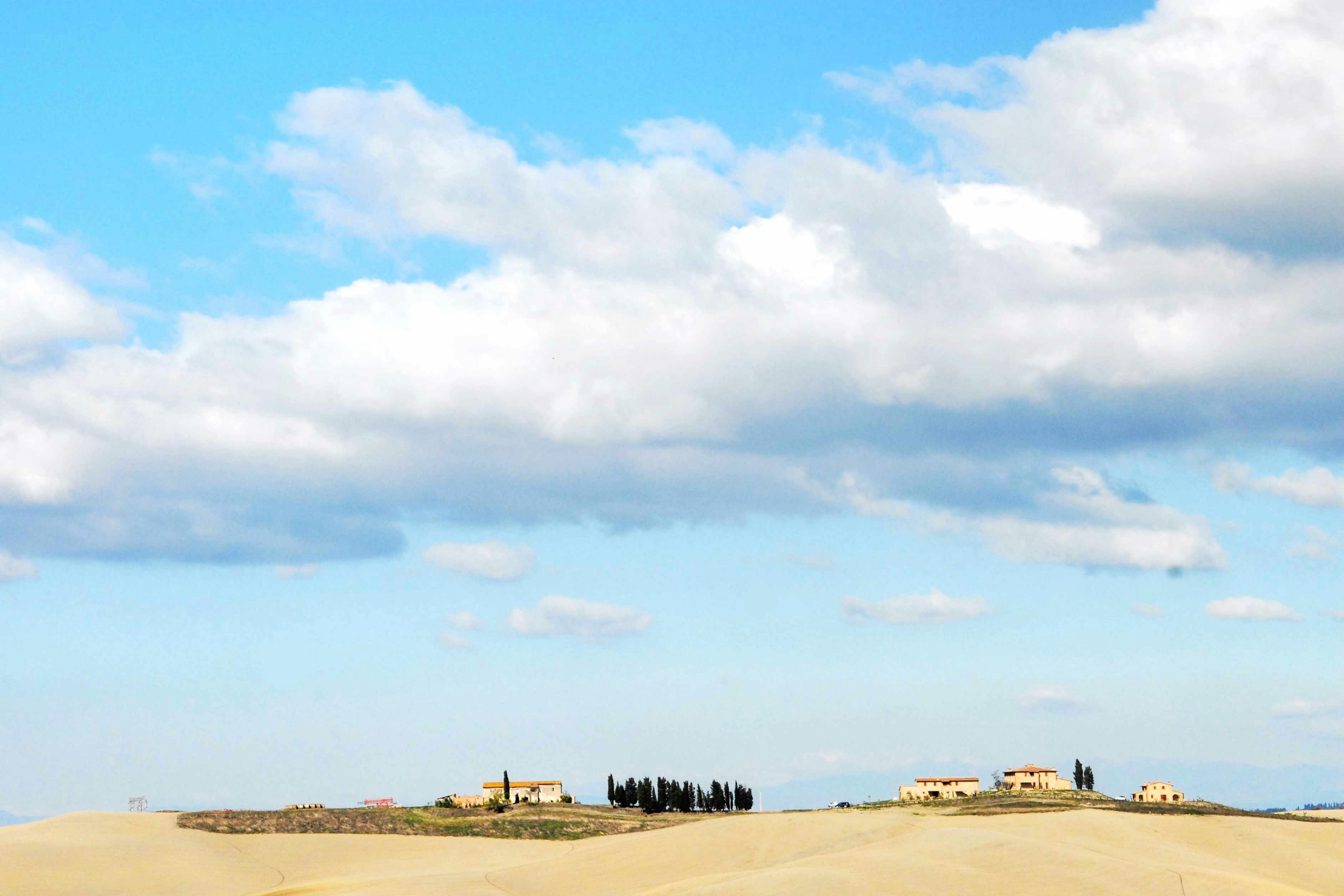 Sunny day in Crete Senesi, Tuscany. Some clouds, mostly blue sky.